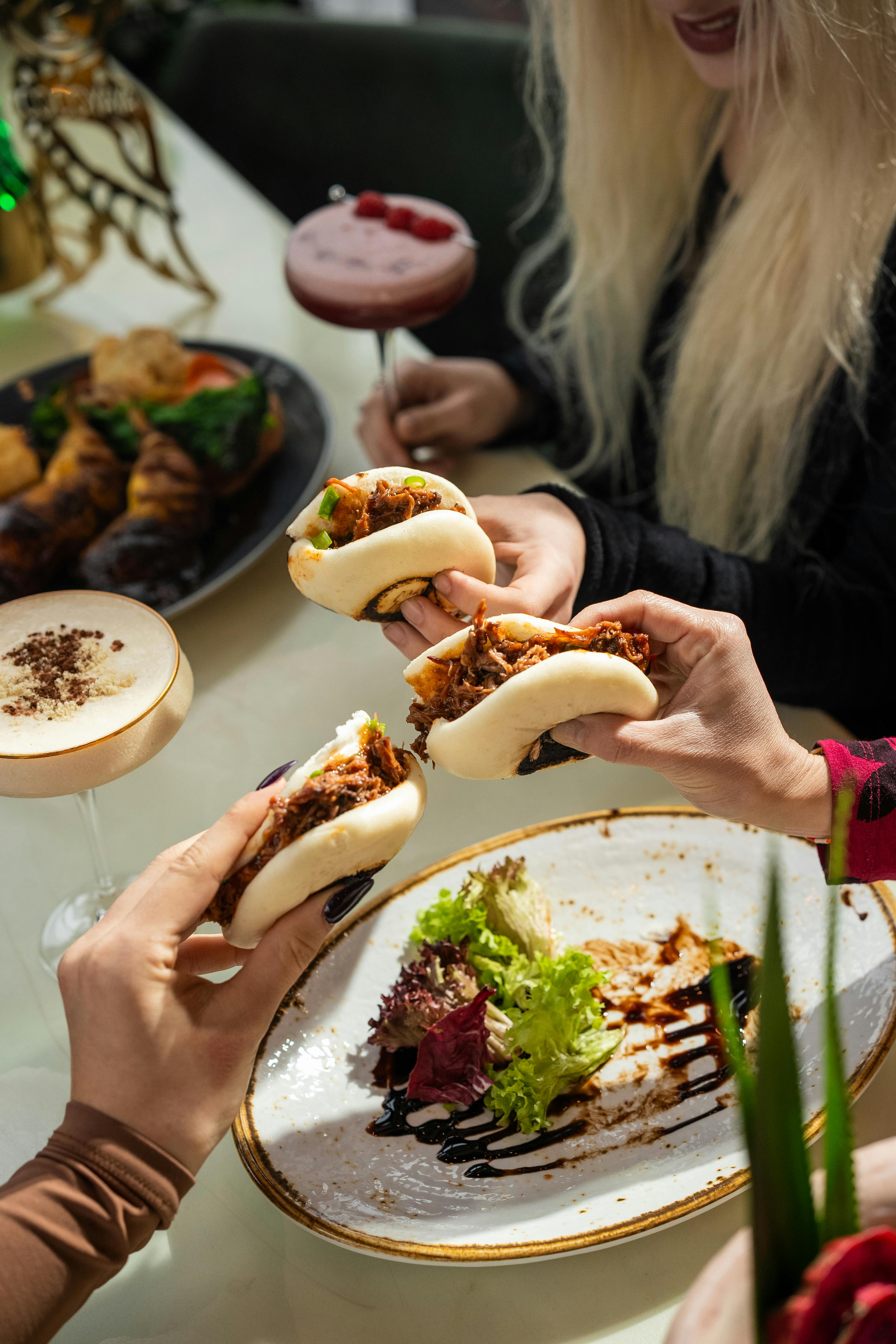 Group of Person Eating Indoors · Free Stock Photo