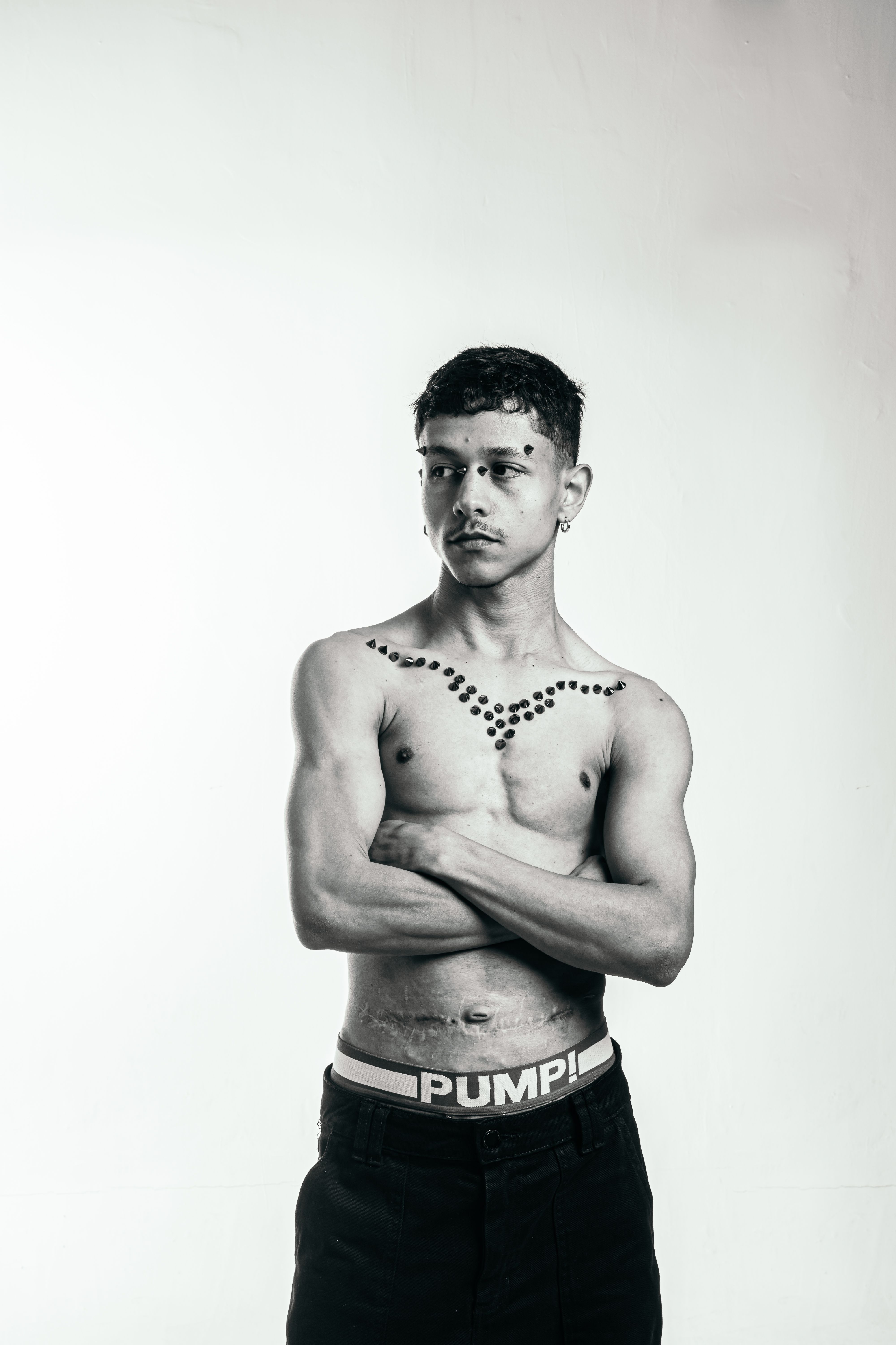 Portrait of Young Man with Body Art and Accessories · Free Stock Photo