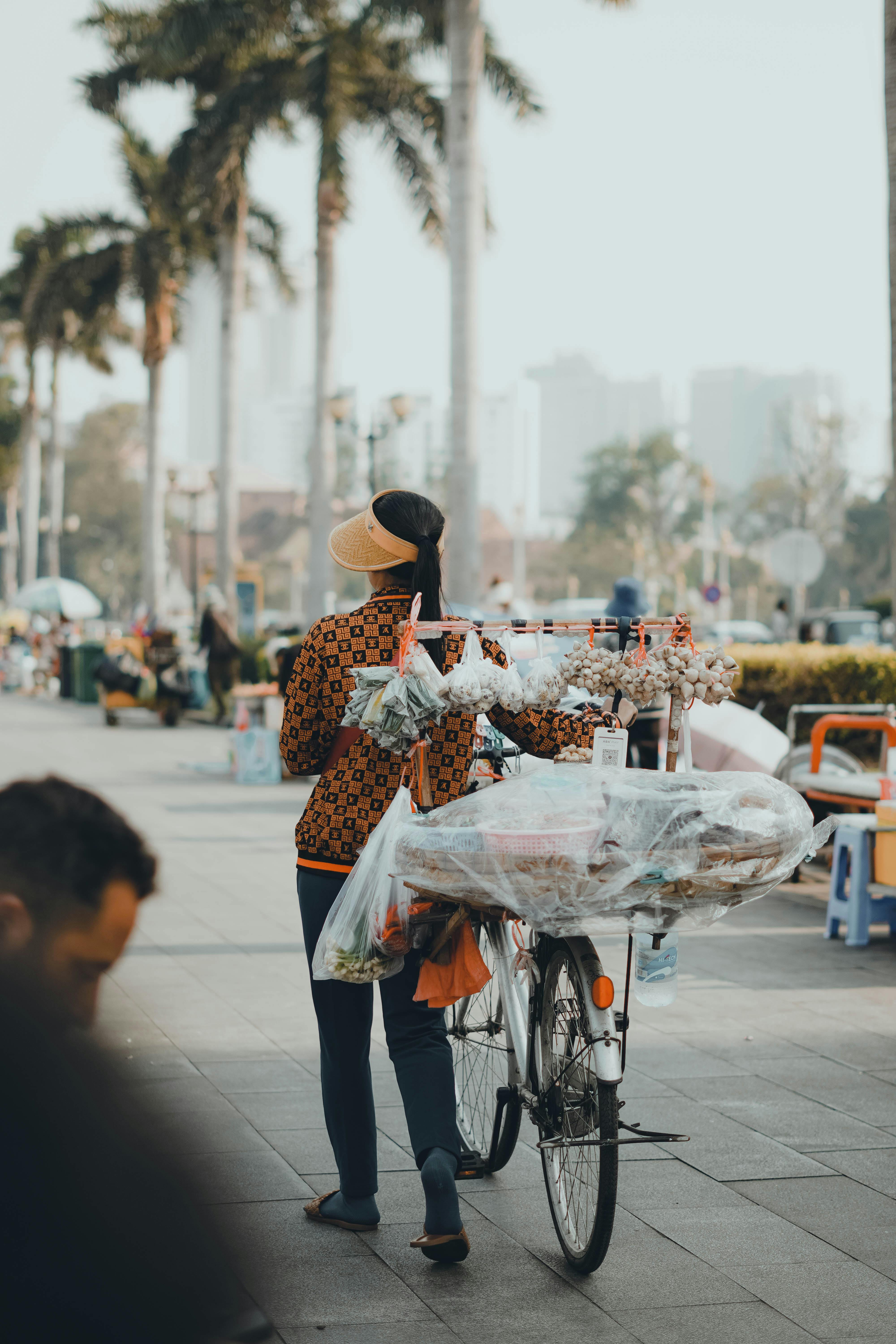 Street Vendor with Bicycle in Phnom Penh · Free Stock Photo