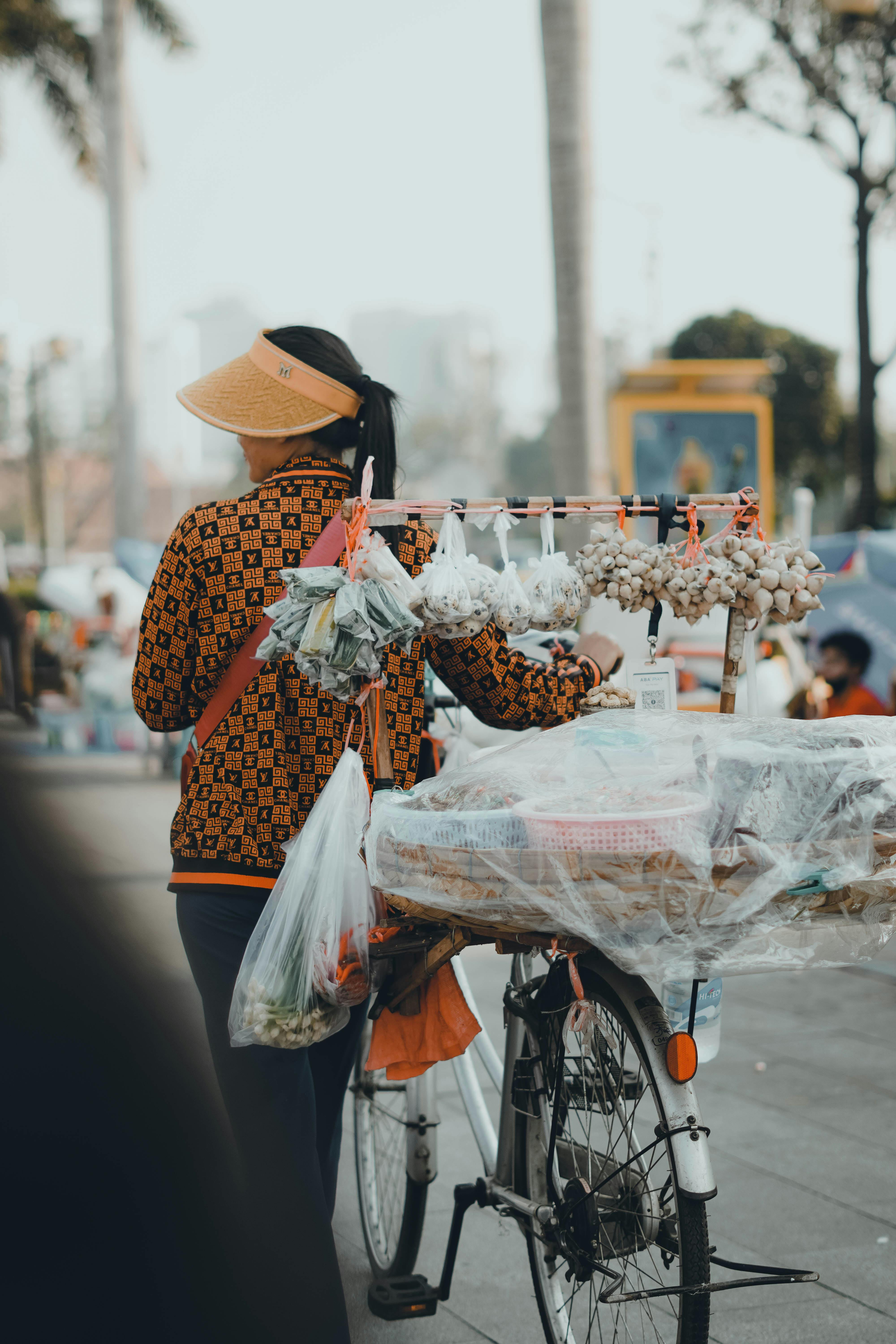 Street Vendor with Bicycle in Phnom Penh · Free Stock Photo