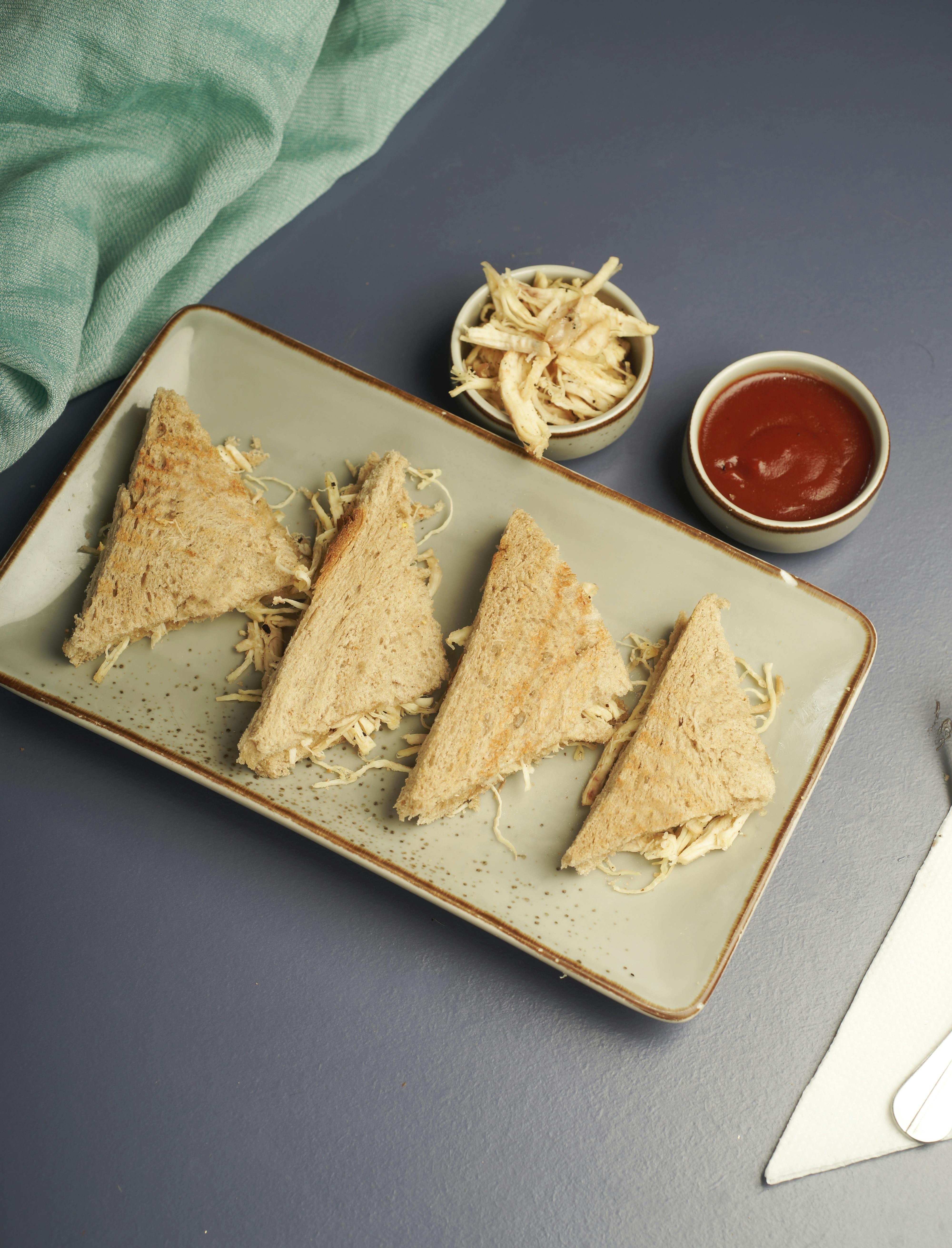 Delicious Triangular Sandwiches on a Plate · Free Stock Photo