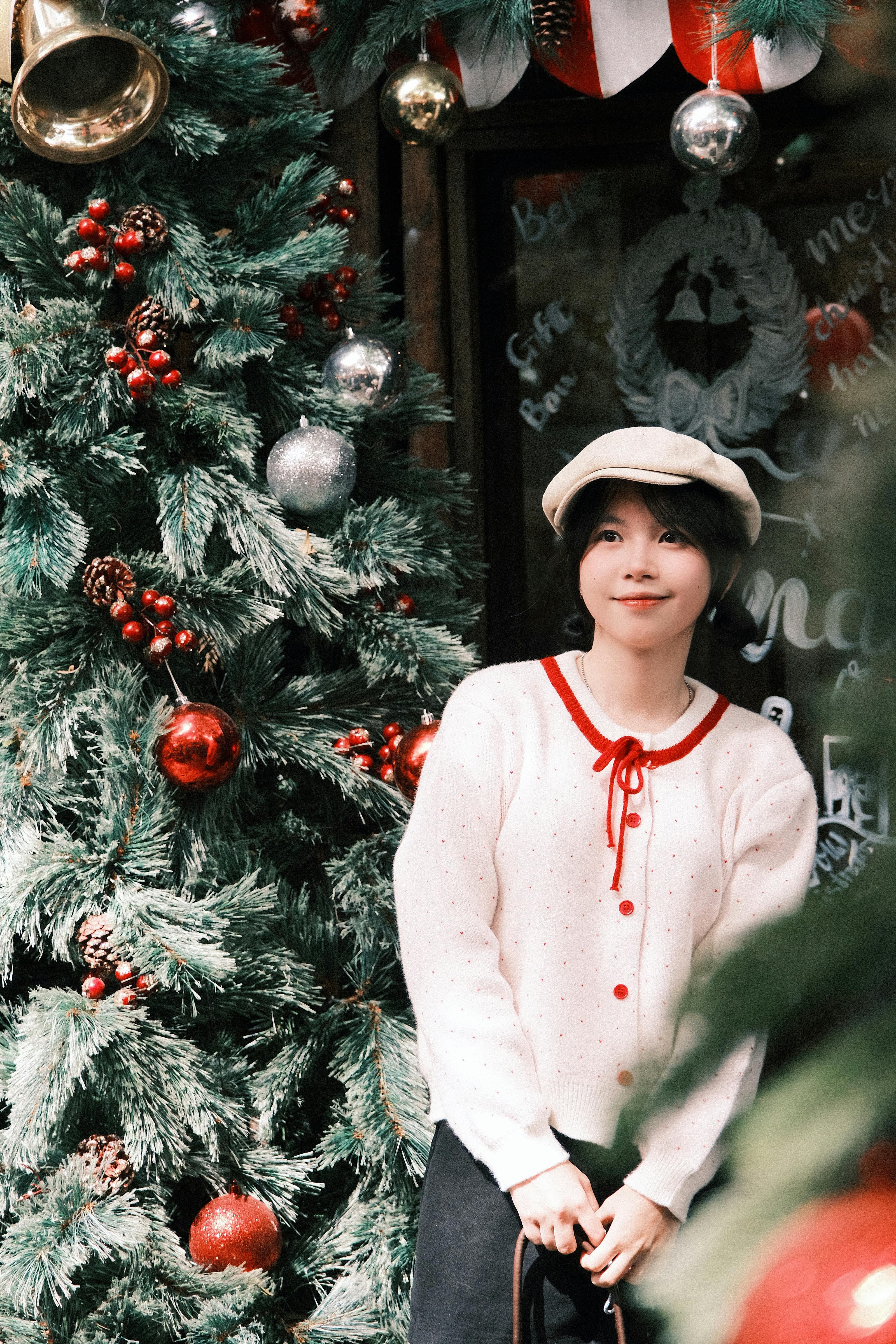 Festive Portrait of a Woman by Christmas Tree · Free Stock Photo