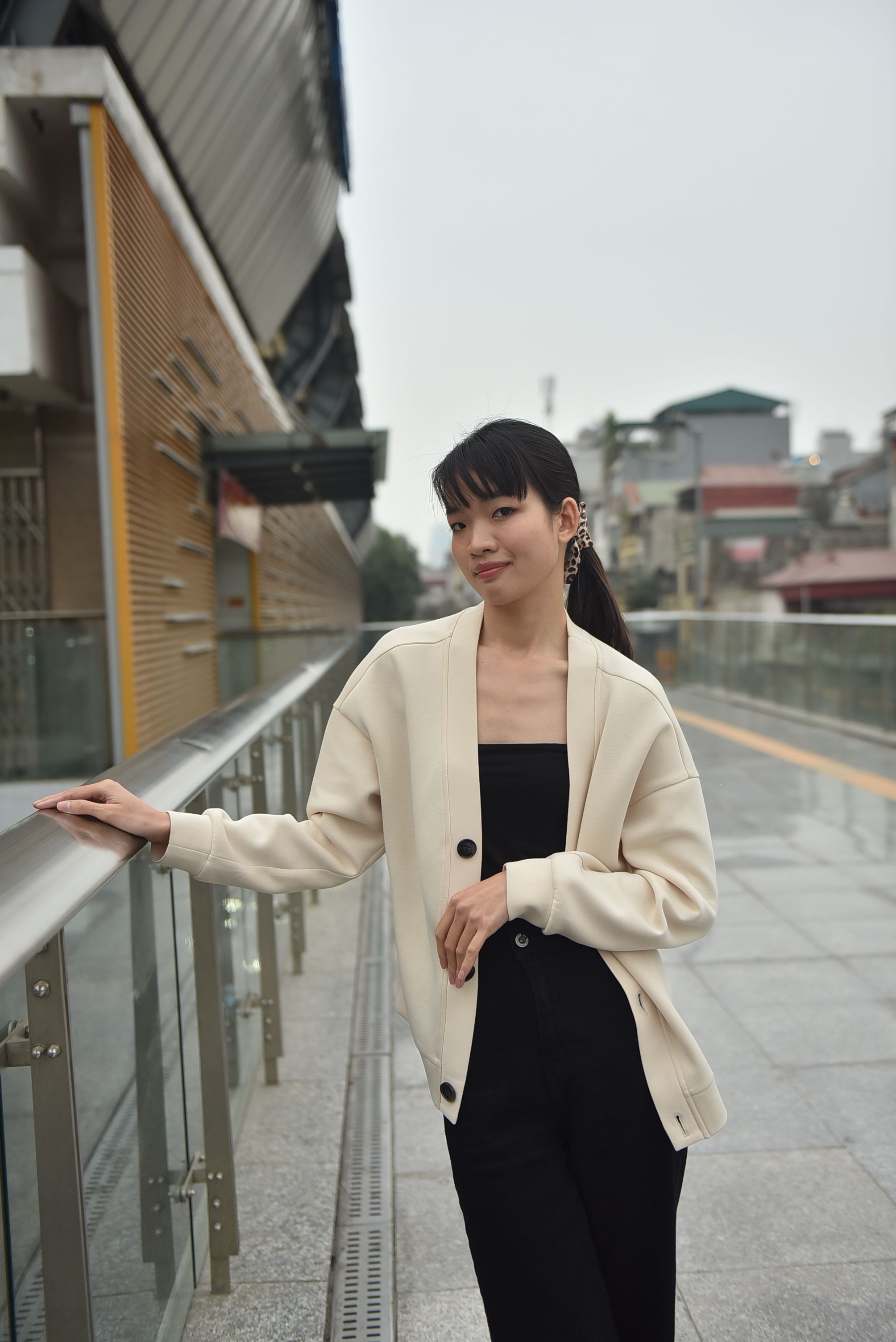 Stylish Woman Posing on Modern Urban Walkway · Free Stock Photo