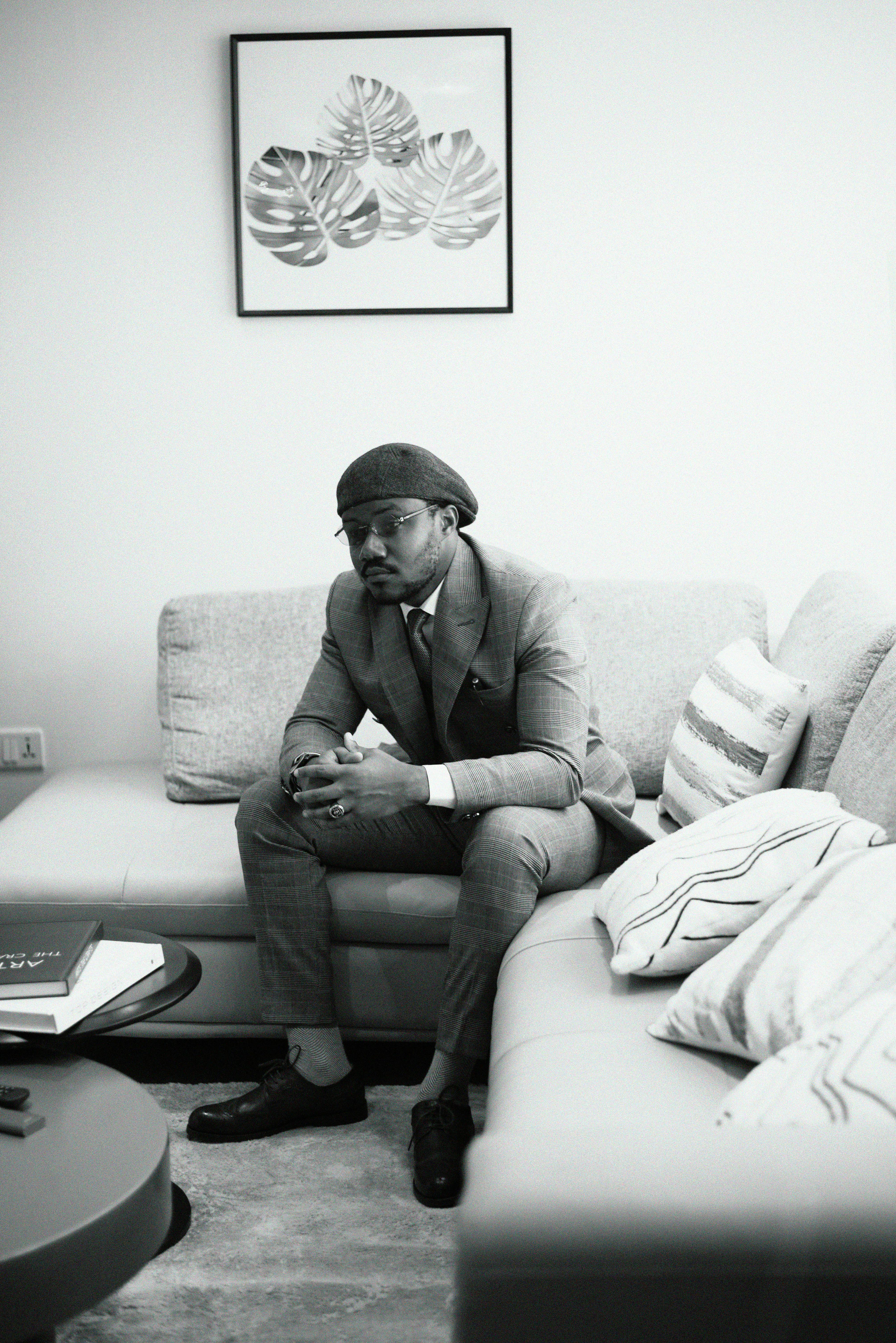 Stylish Man in Suit Relaxing Indoors · Free Stock Photo