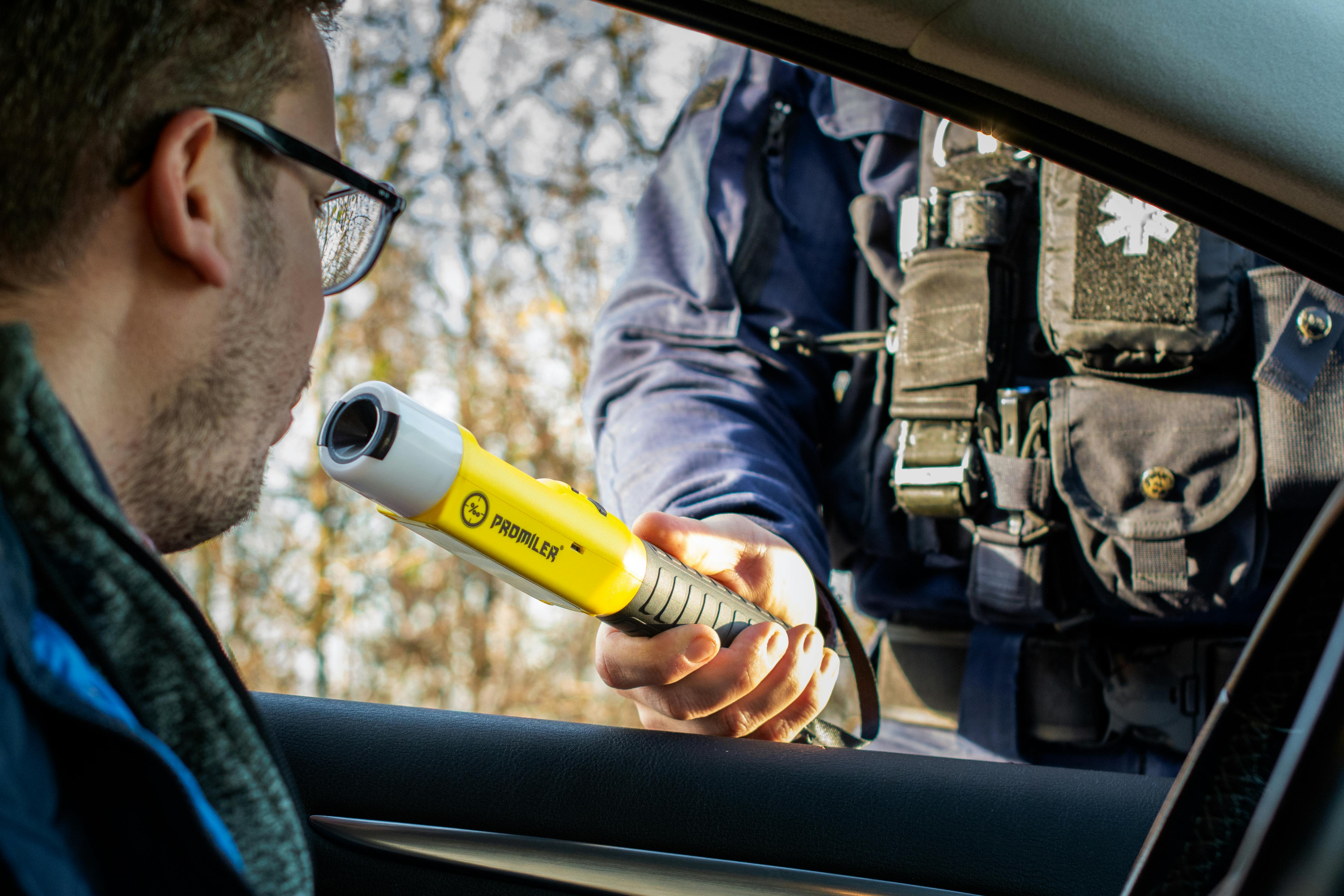 Police Officer During Breathalyzer Test at Traffic Stop · Free Stock Photo