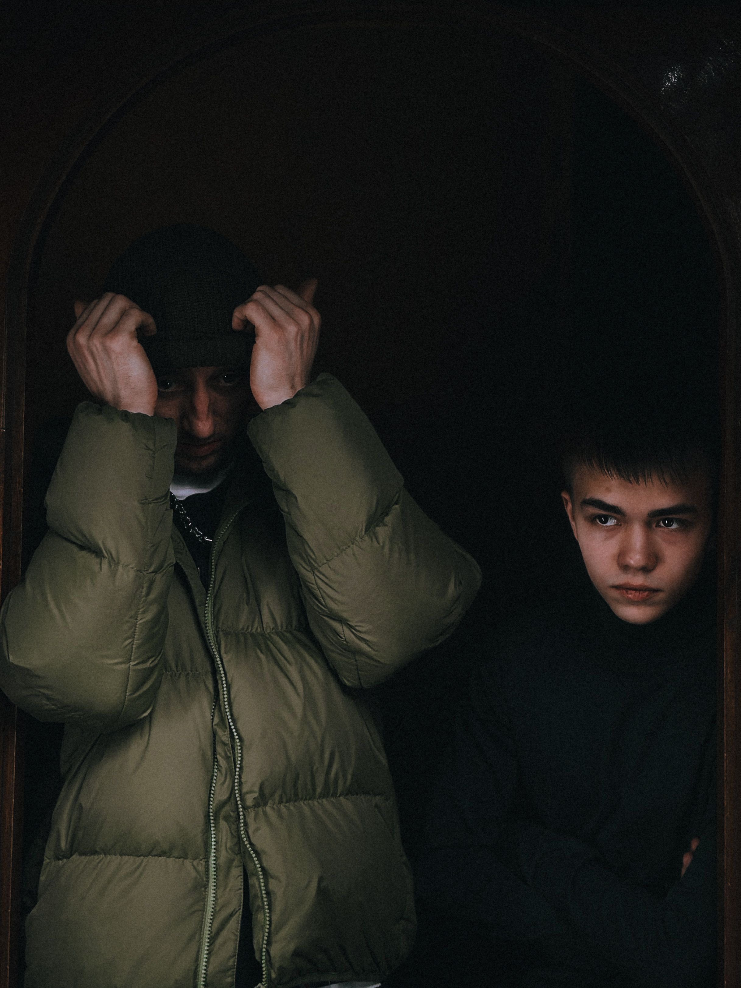 Two Teenagers in Dark Urban Setting · Free Stock Photo