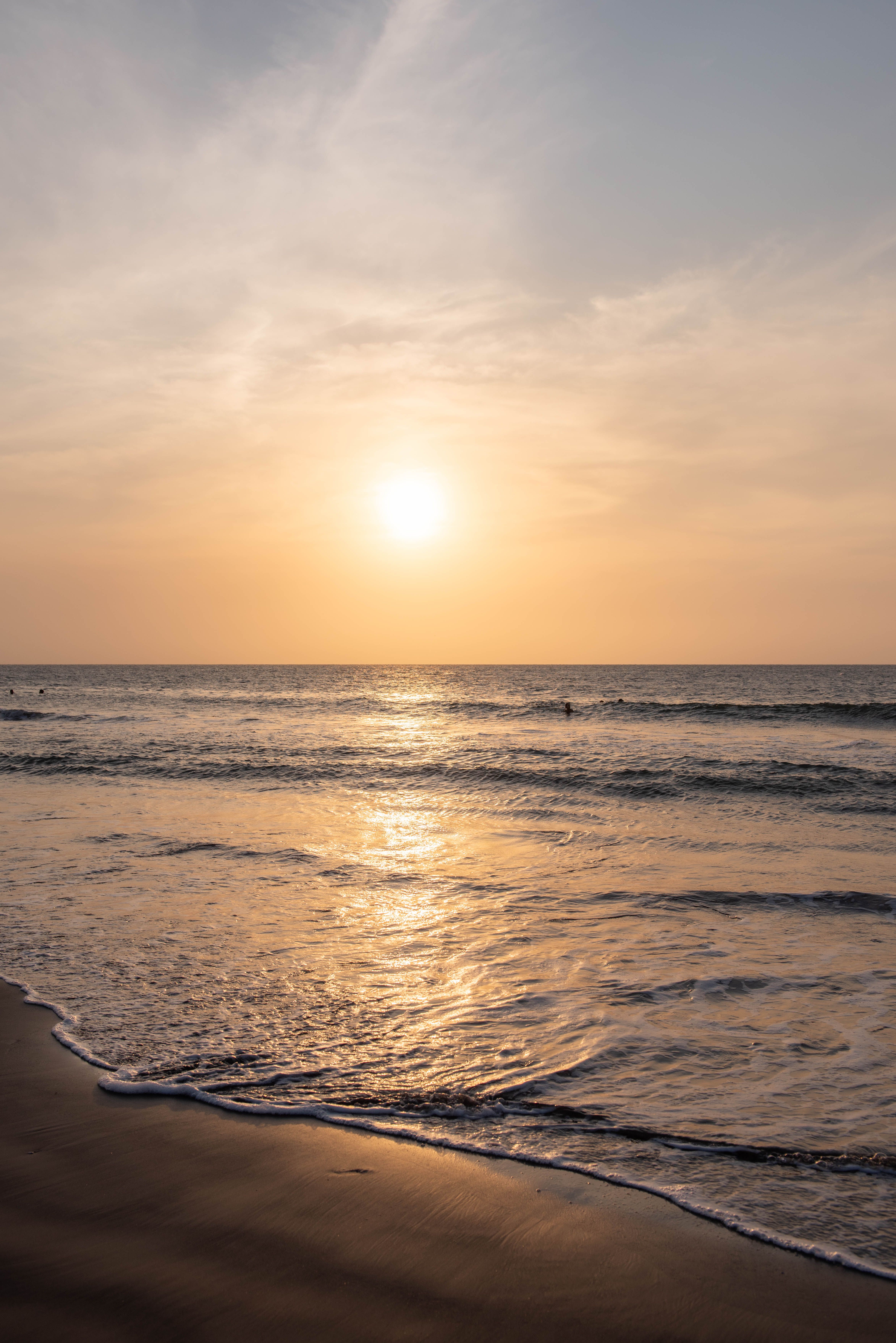 Tranquil Beach Sunset Over Calm Ocean Waves · Free Stock Photo