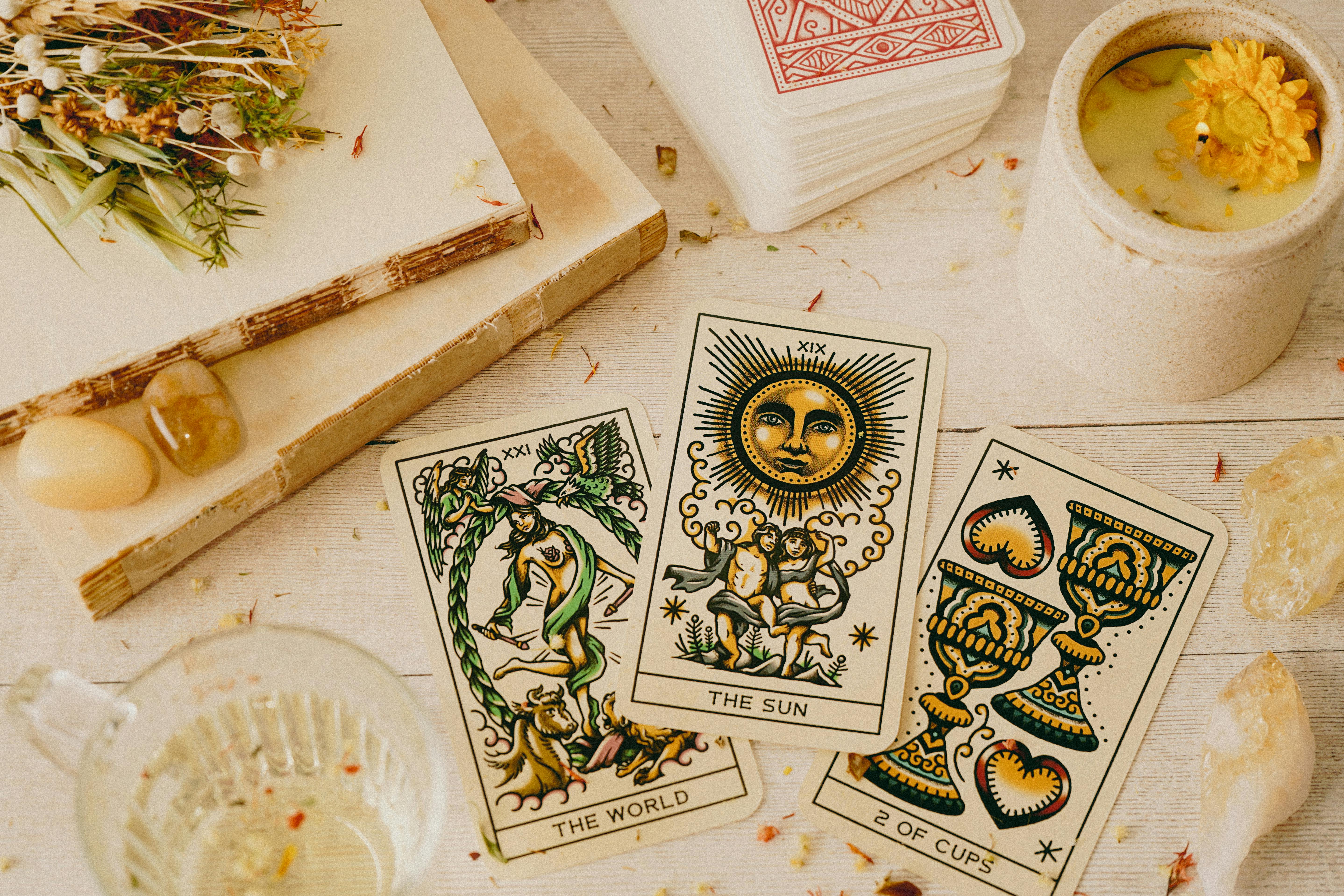 Mystical Tarot Card Reading Setup on Wooden Table · Free Stock Photo