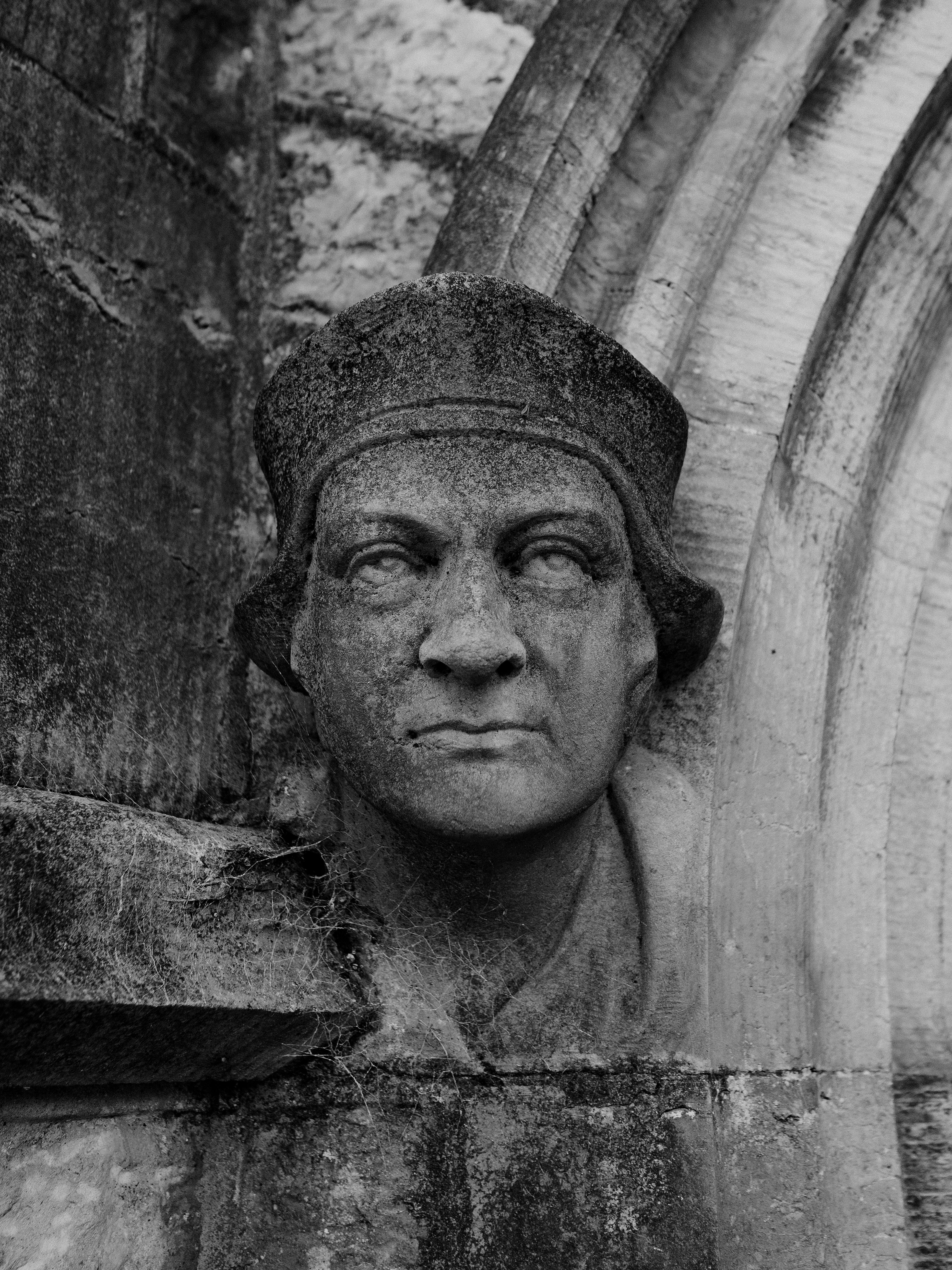 Medieval Stone Sculpture of a Human Face · Free Stock Photo