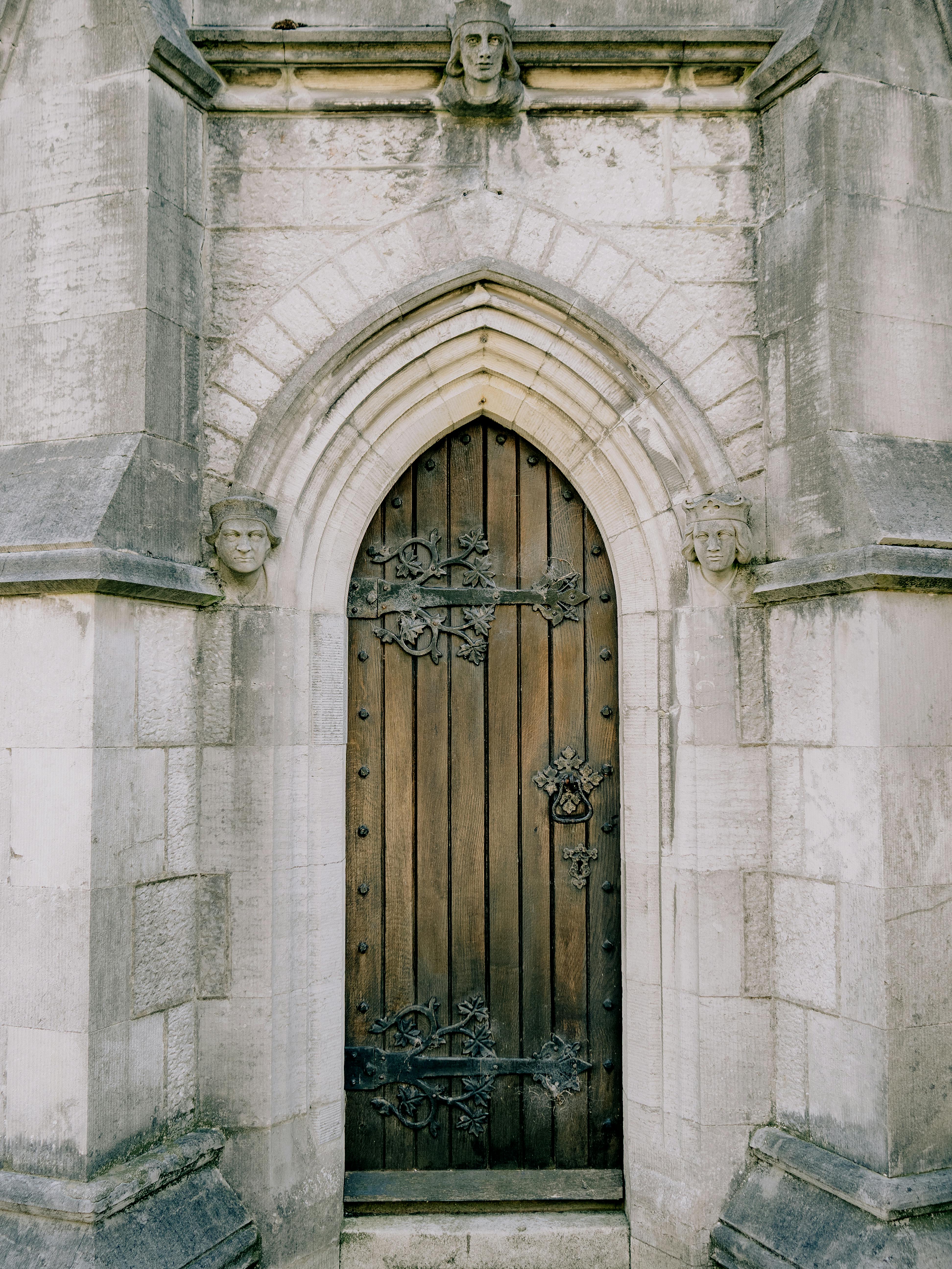 Gothic Stone Archway with Wooden Door · Free Stock Photo