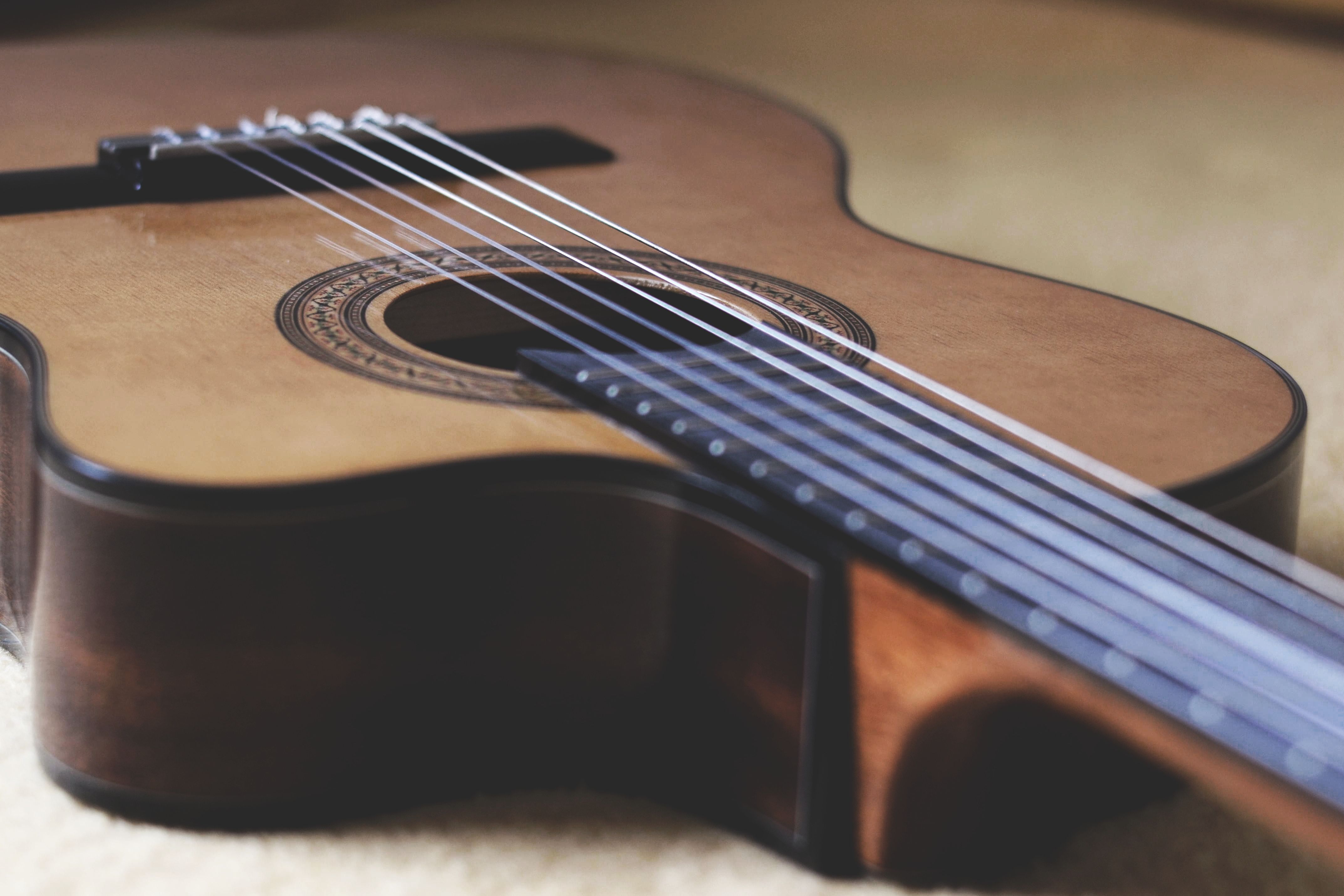 Close-Up Shot of an Acoustic Guitar · Free Stock Photo