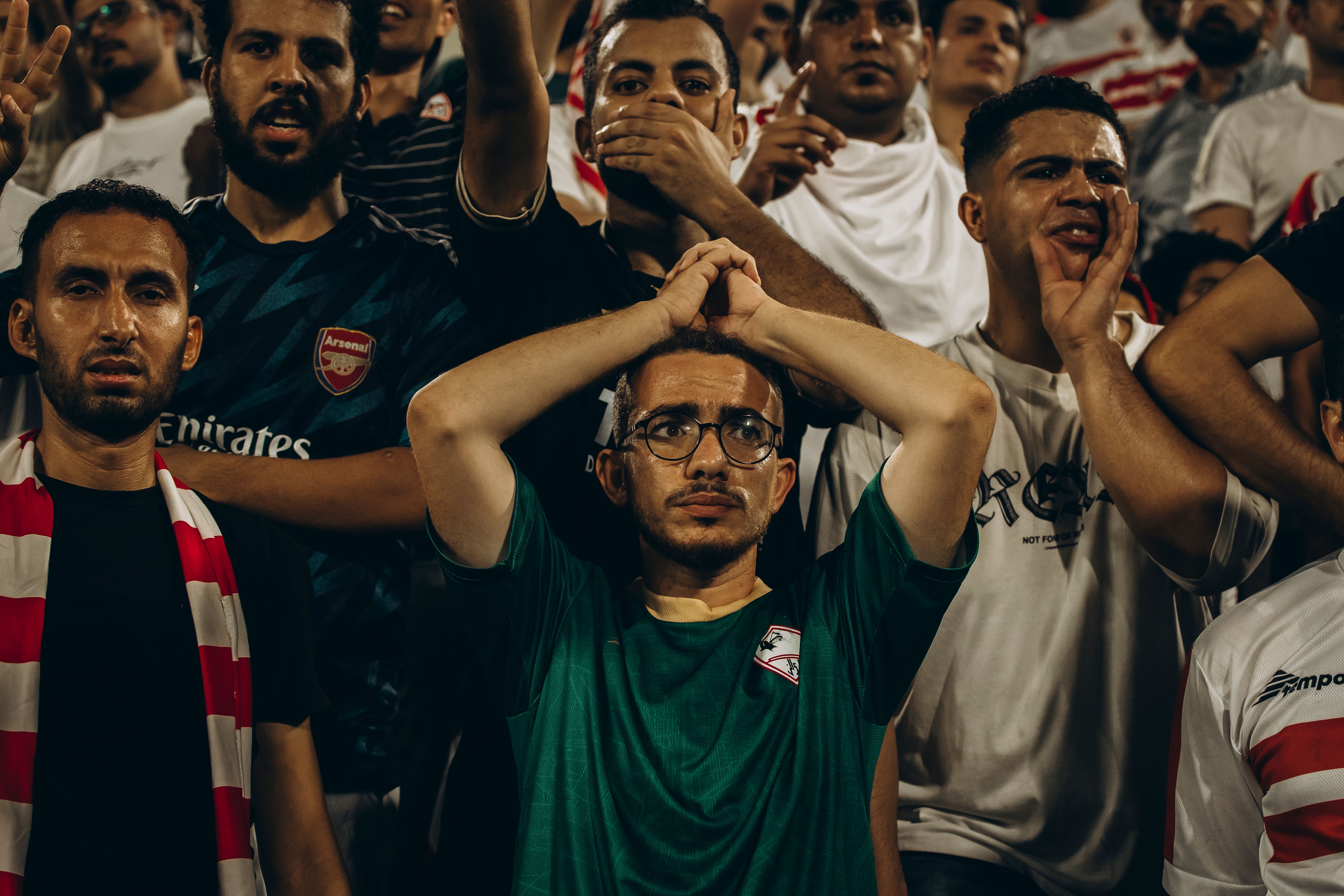 Passionate Football Fans at a Live Match · Free Stock Photo