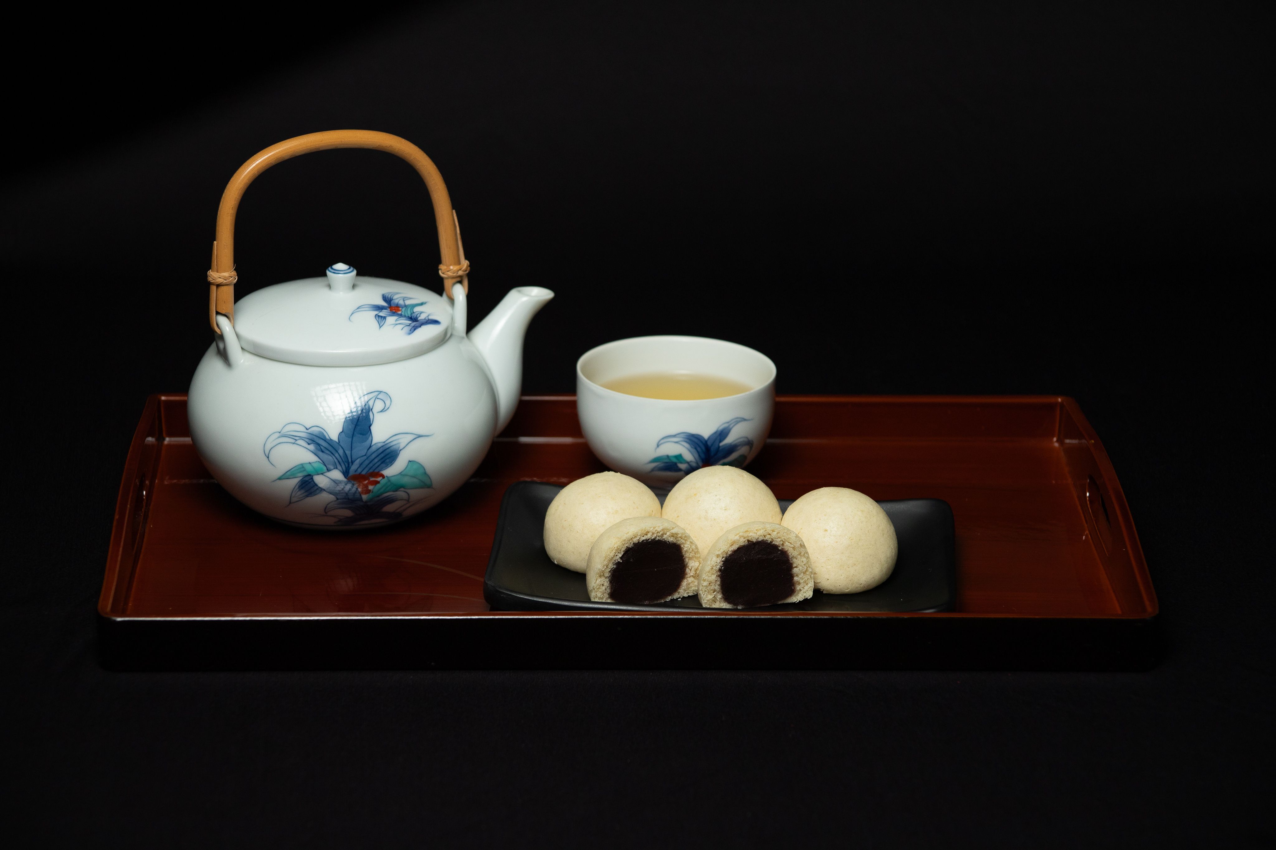 Elegant Japanese Tea Set with Traditional Snacks · Free Stock Photo