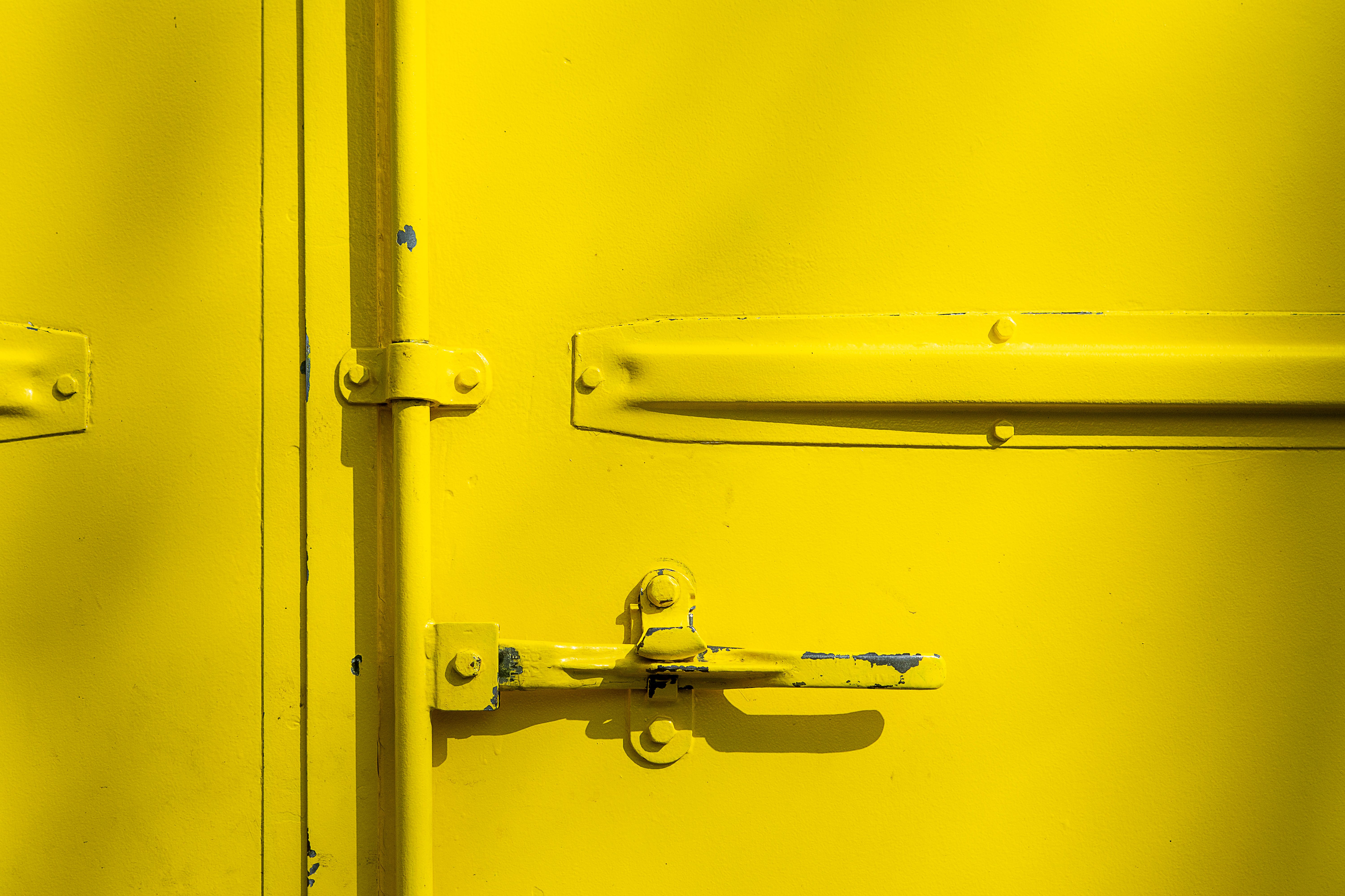 Vibrant Yellow Metal Door with Secure Latch · Free Stock Photo