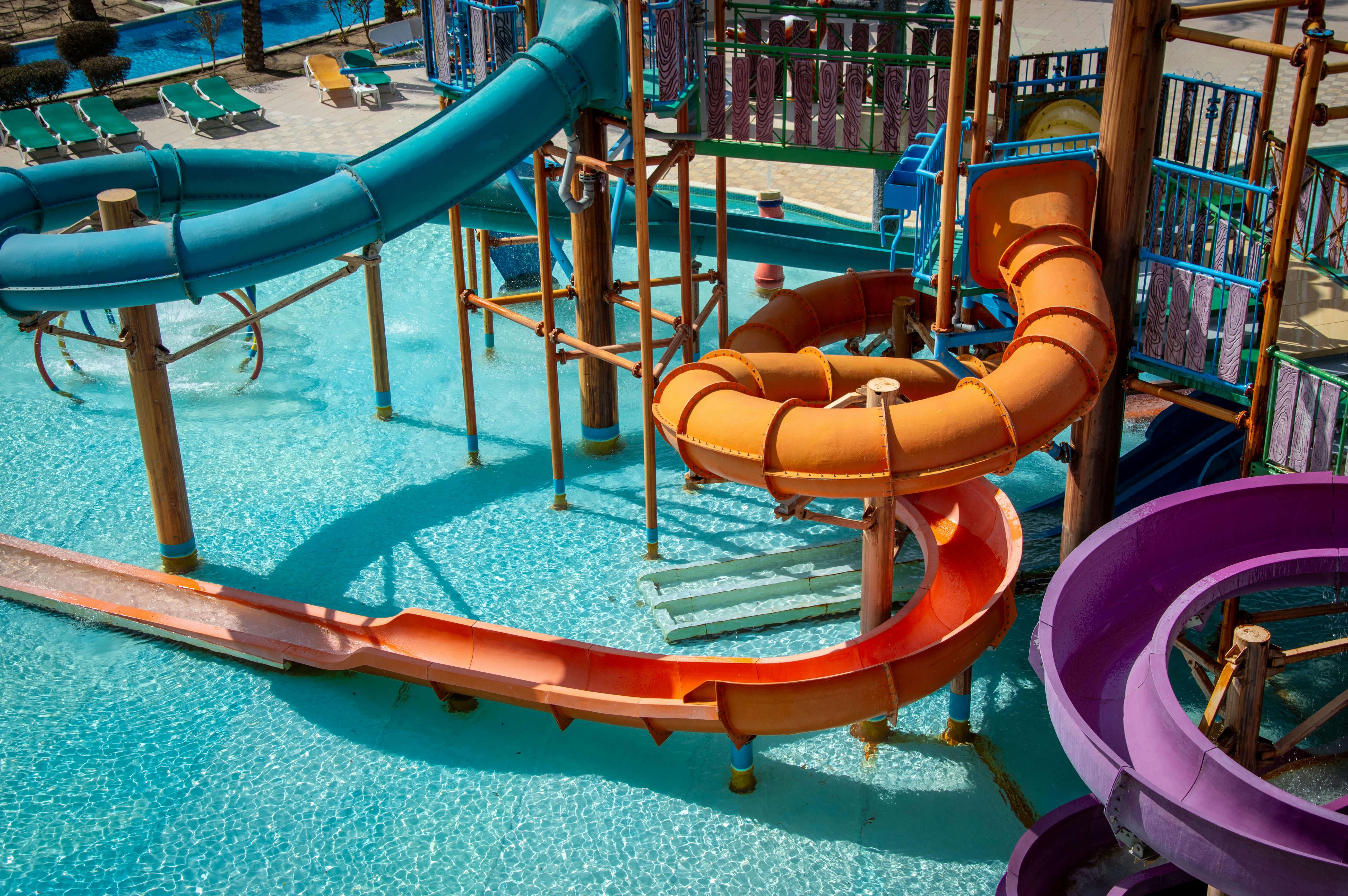 Colorful Water Park Slides on a Sunny Day · Free Stock Photo
