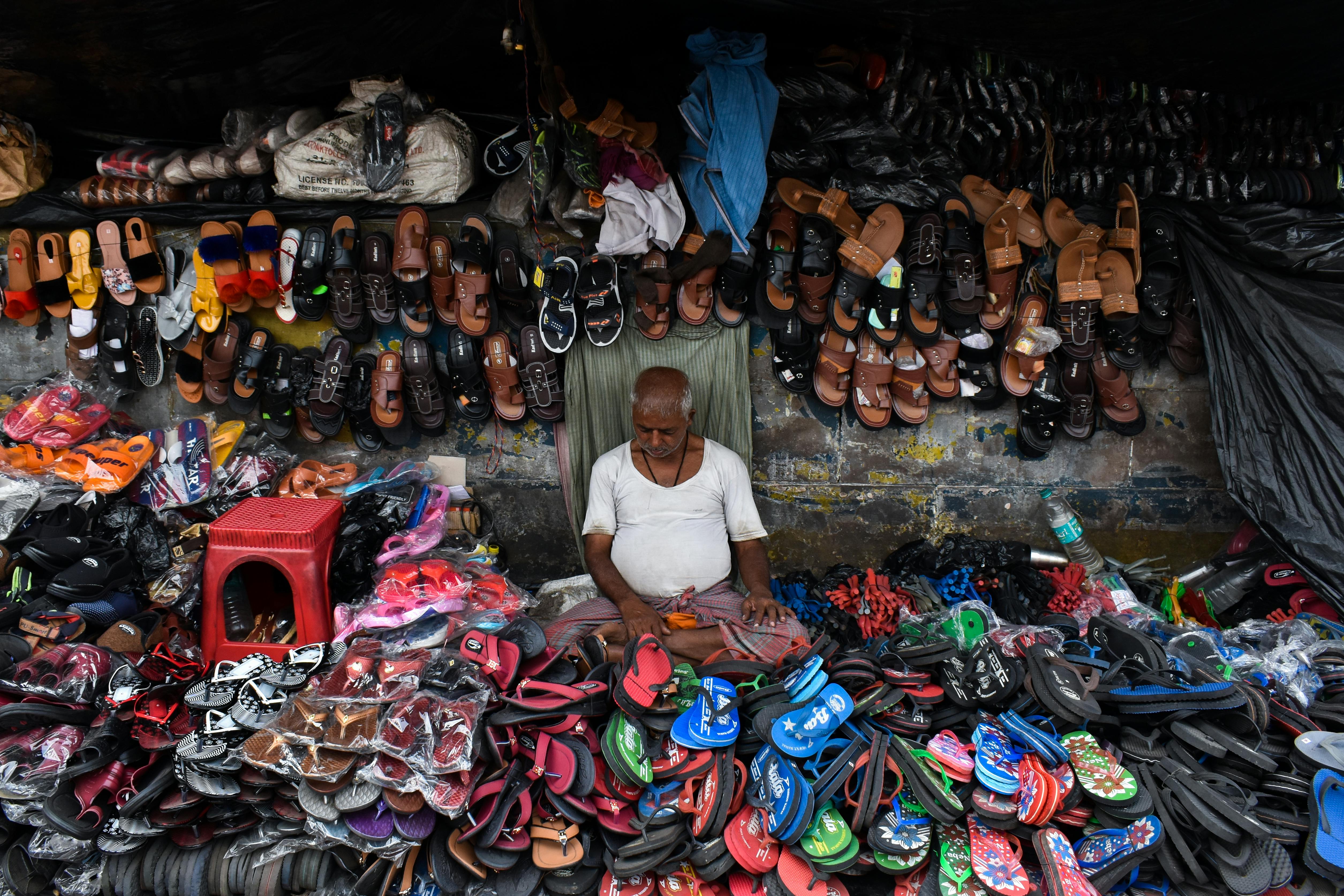 Street Vendor Selling Shoes in Kolkata Market · Free Stock Photo