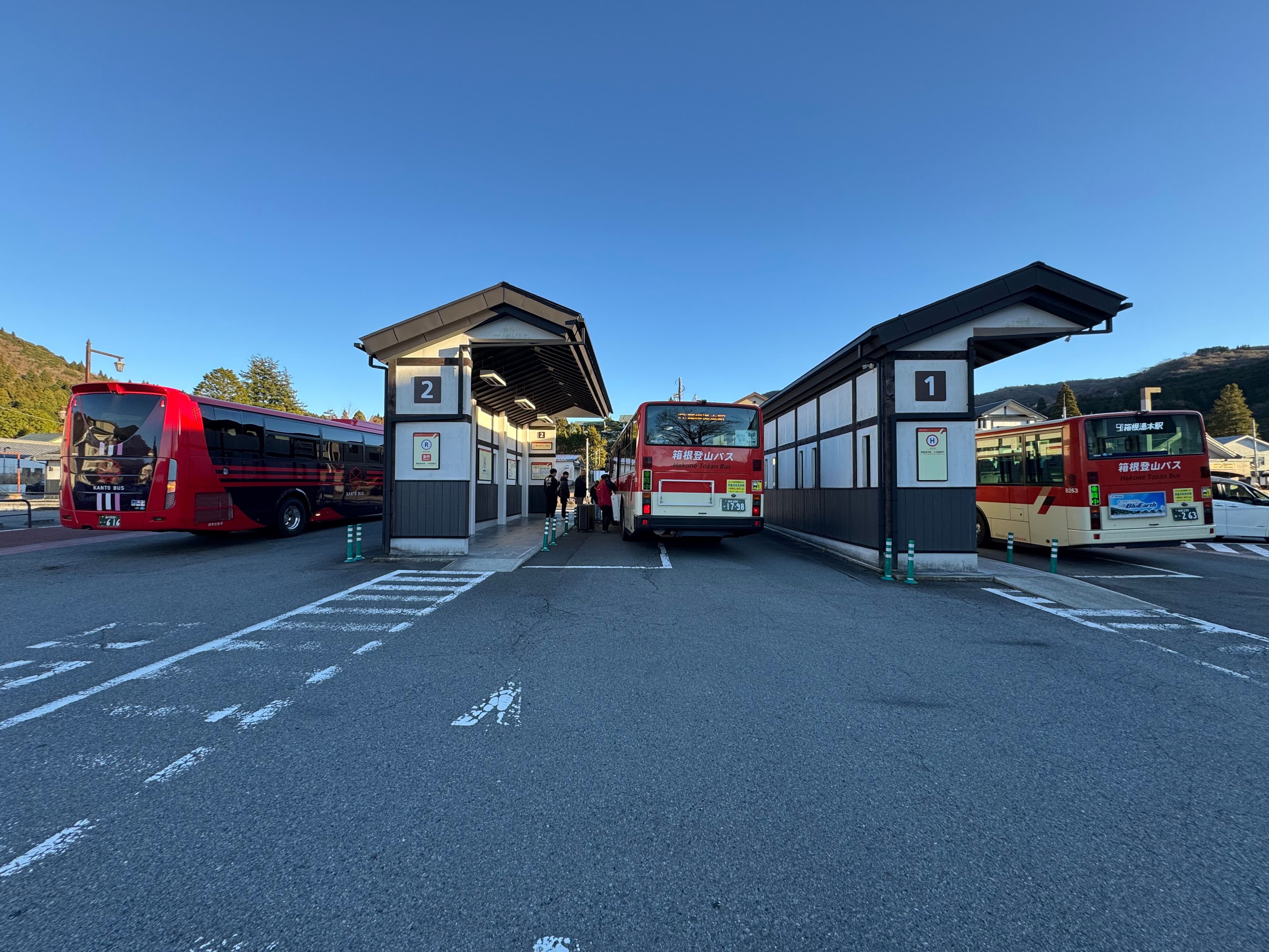 Bus Station in Serene Outdoor Setting with Clear Sky · Free Stock Photo