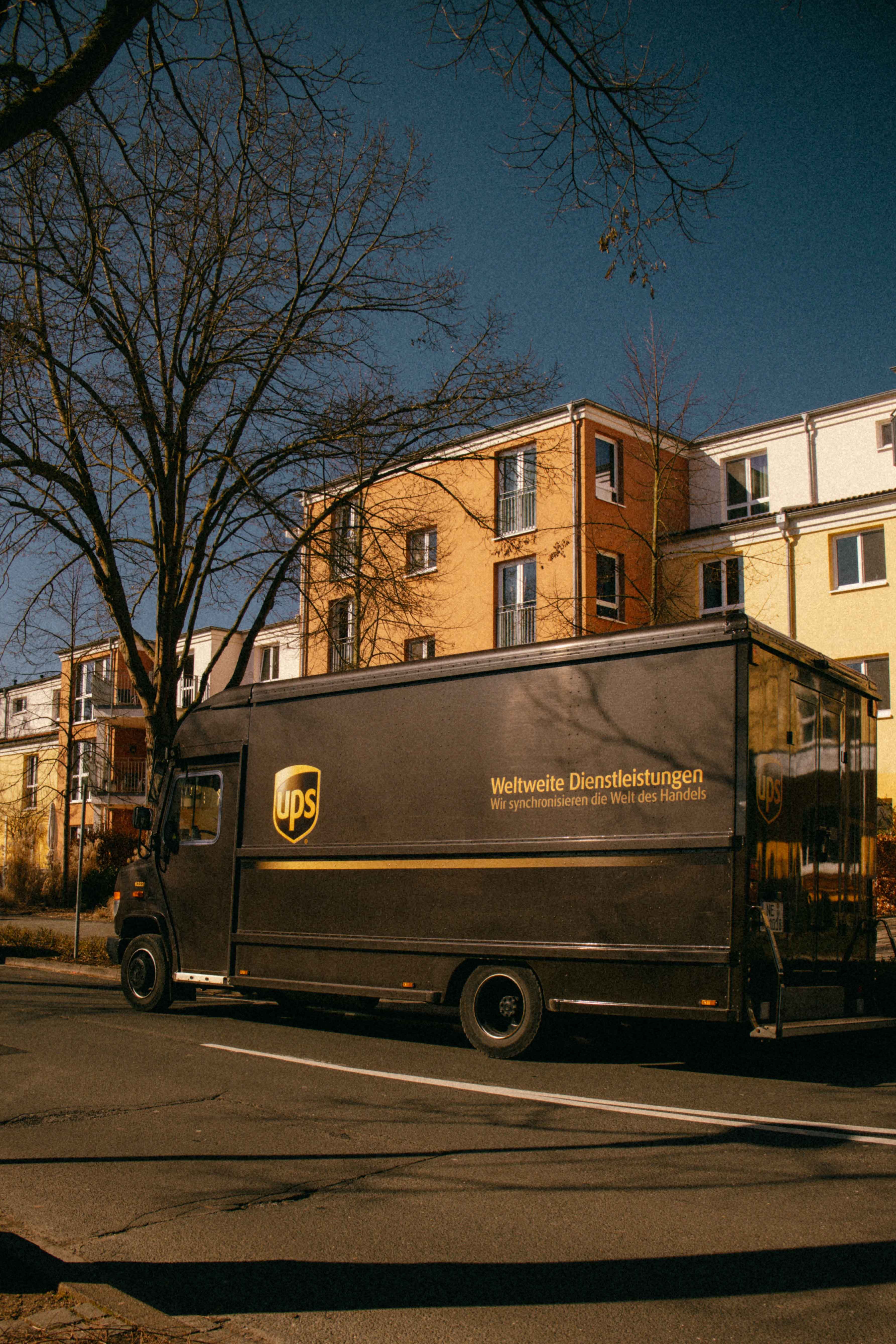UPS Delivery Truck on Urban Street in Daylight · Free Stock Photo