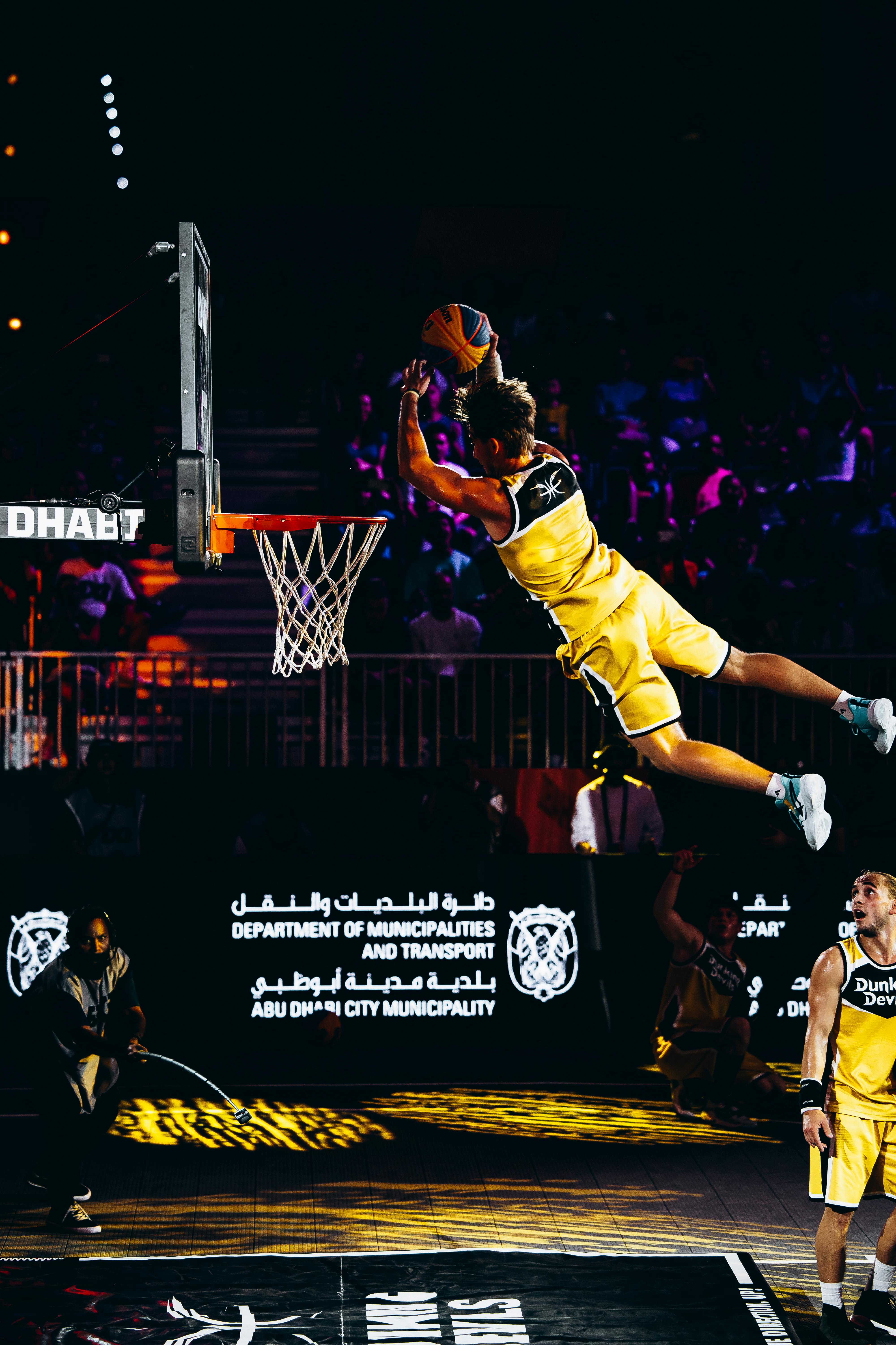 Dynamic Basketball Dunk at Abu Dhabi Event · Free Stock Photo