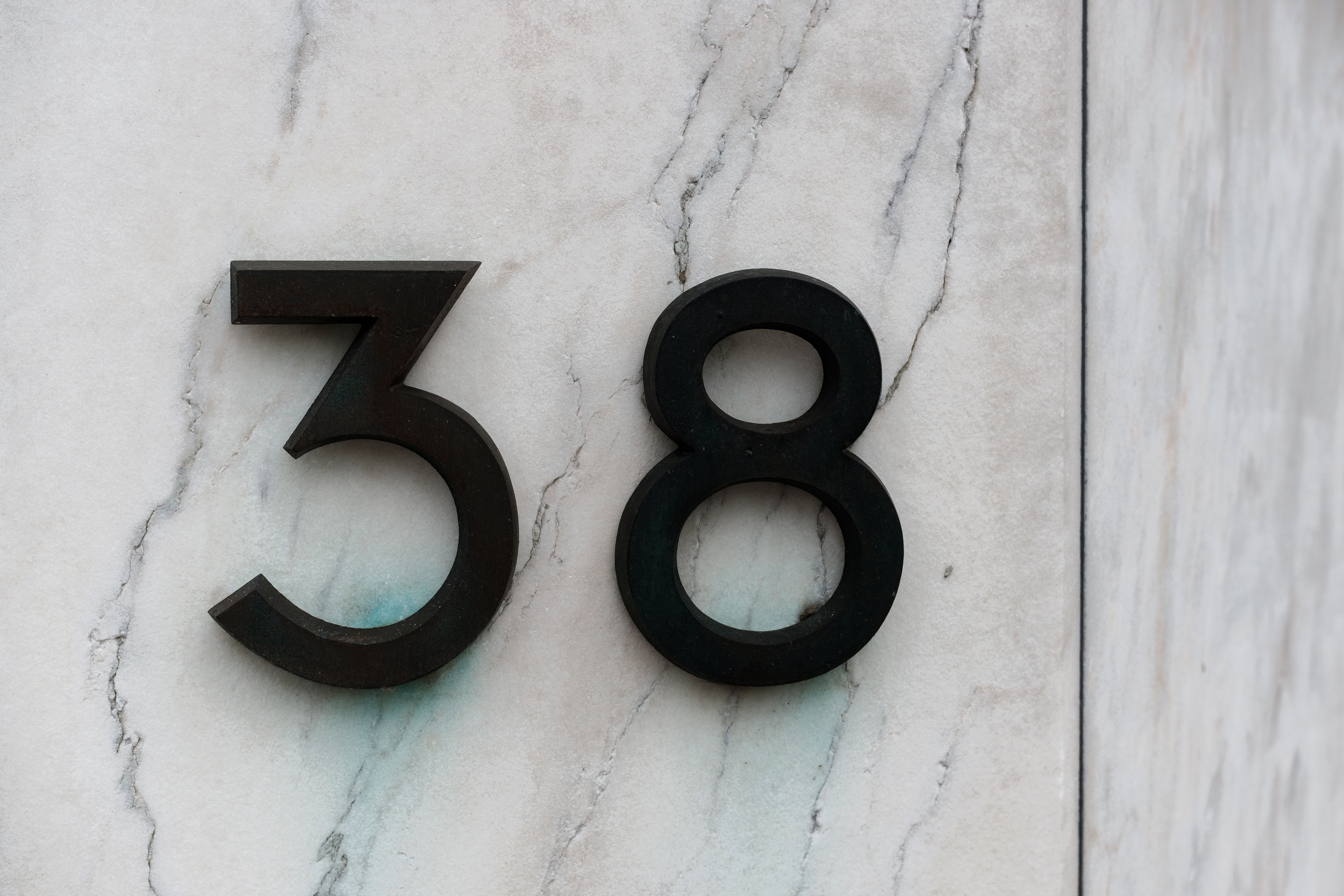 Modern House Number 38 on Marble Wall · Free Stock Photo
