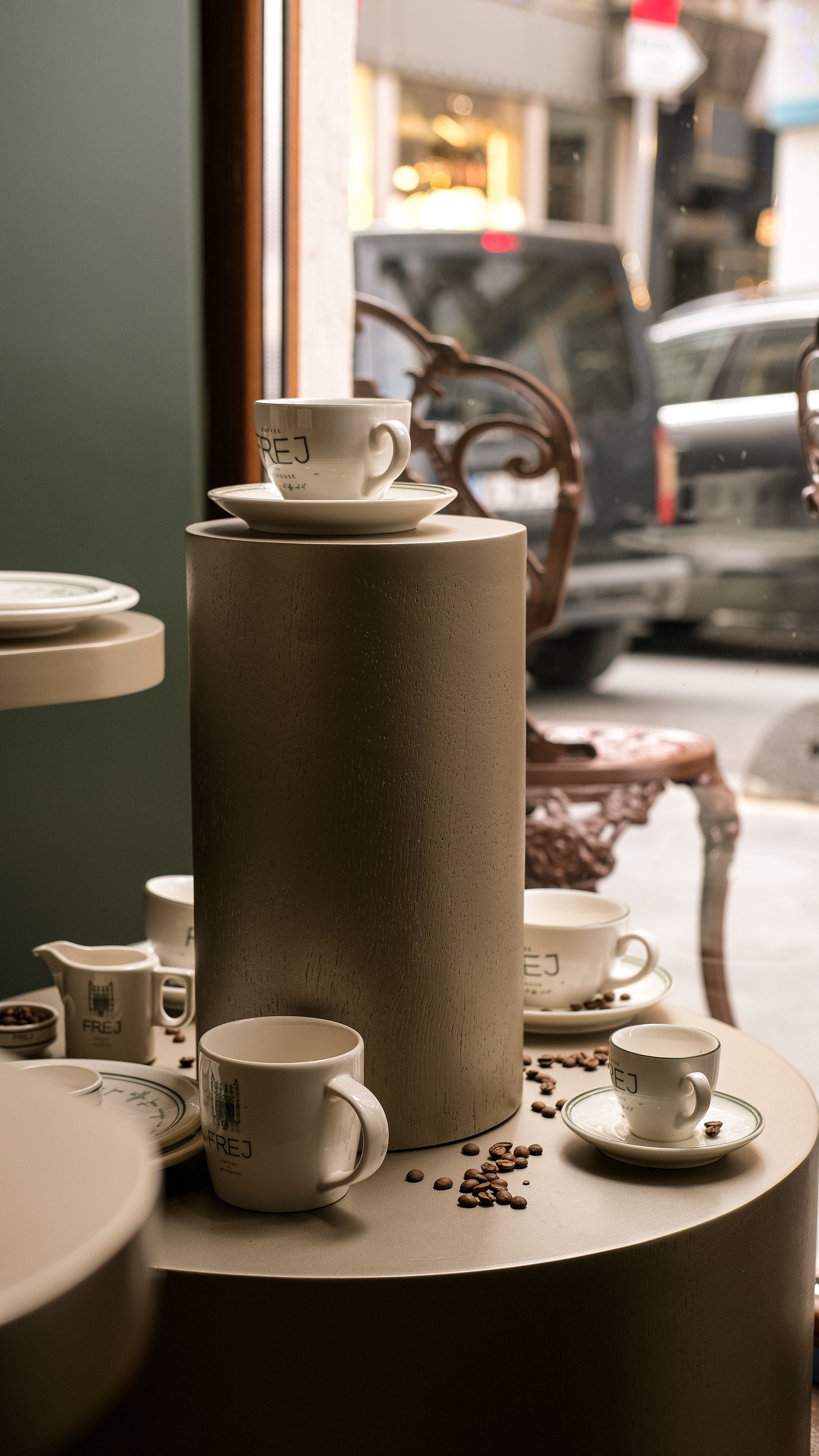 Elegant Coffee Cup Display in Urban Café · Free Stock Photo