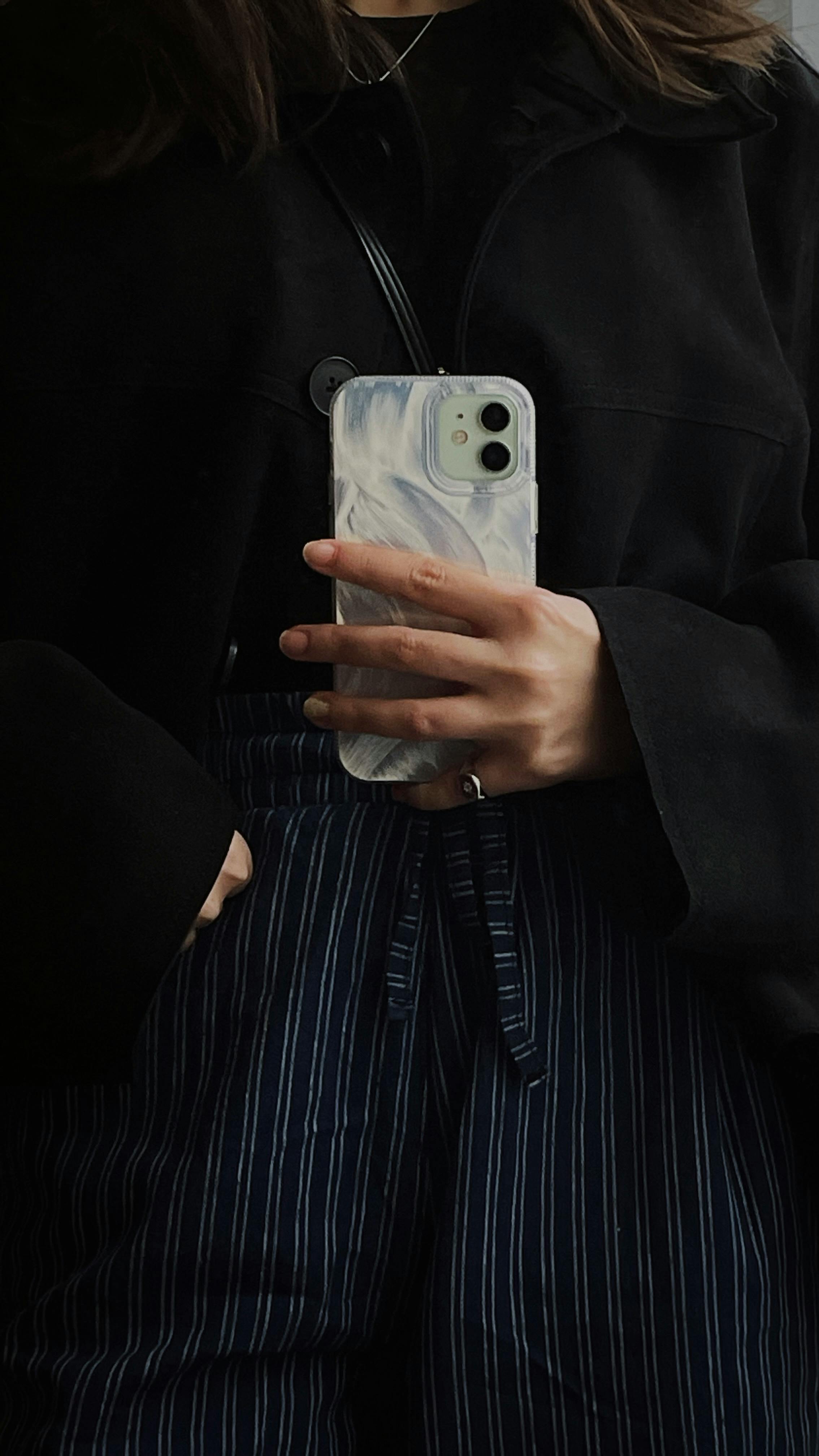 Sleek Mirror Reflection Phone Photography · Free Stock Photo