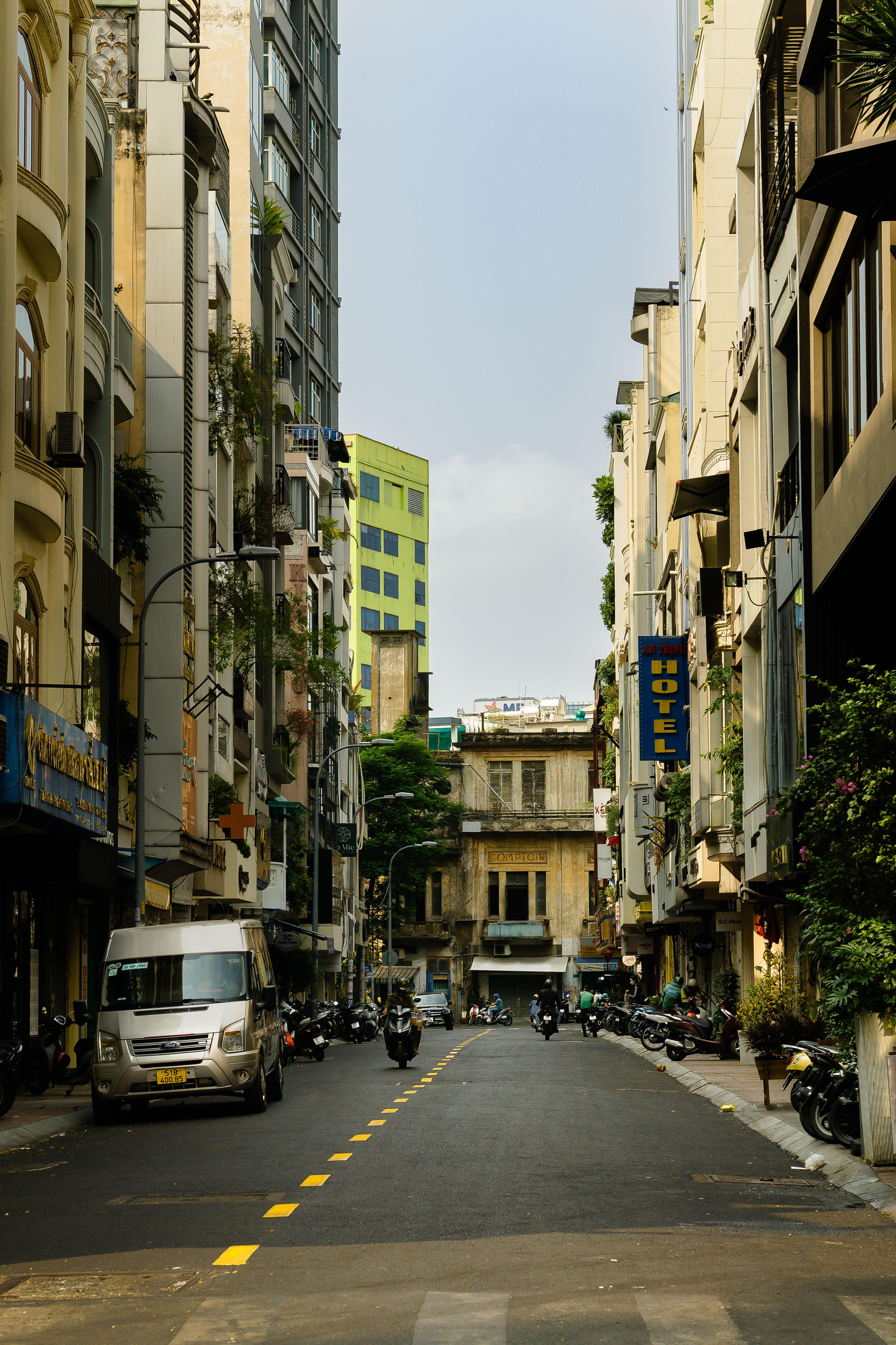 Bustling Urban Street in Asia on a Sunny Day · Free Stock Photo