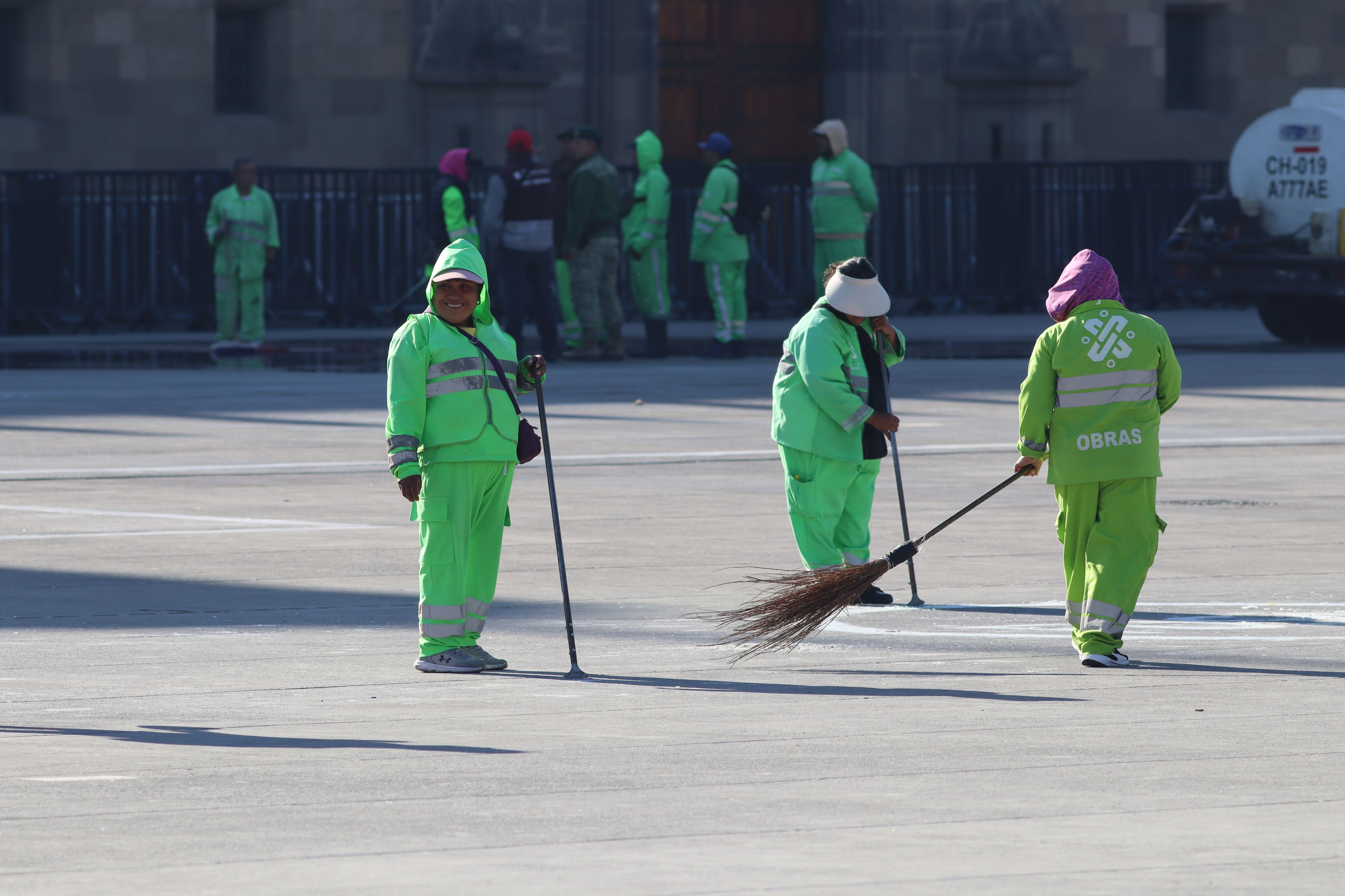 Street Cleaners in Mexico City's Public Square · Free Stock Photo