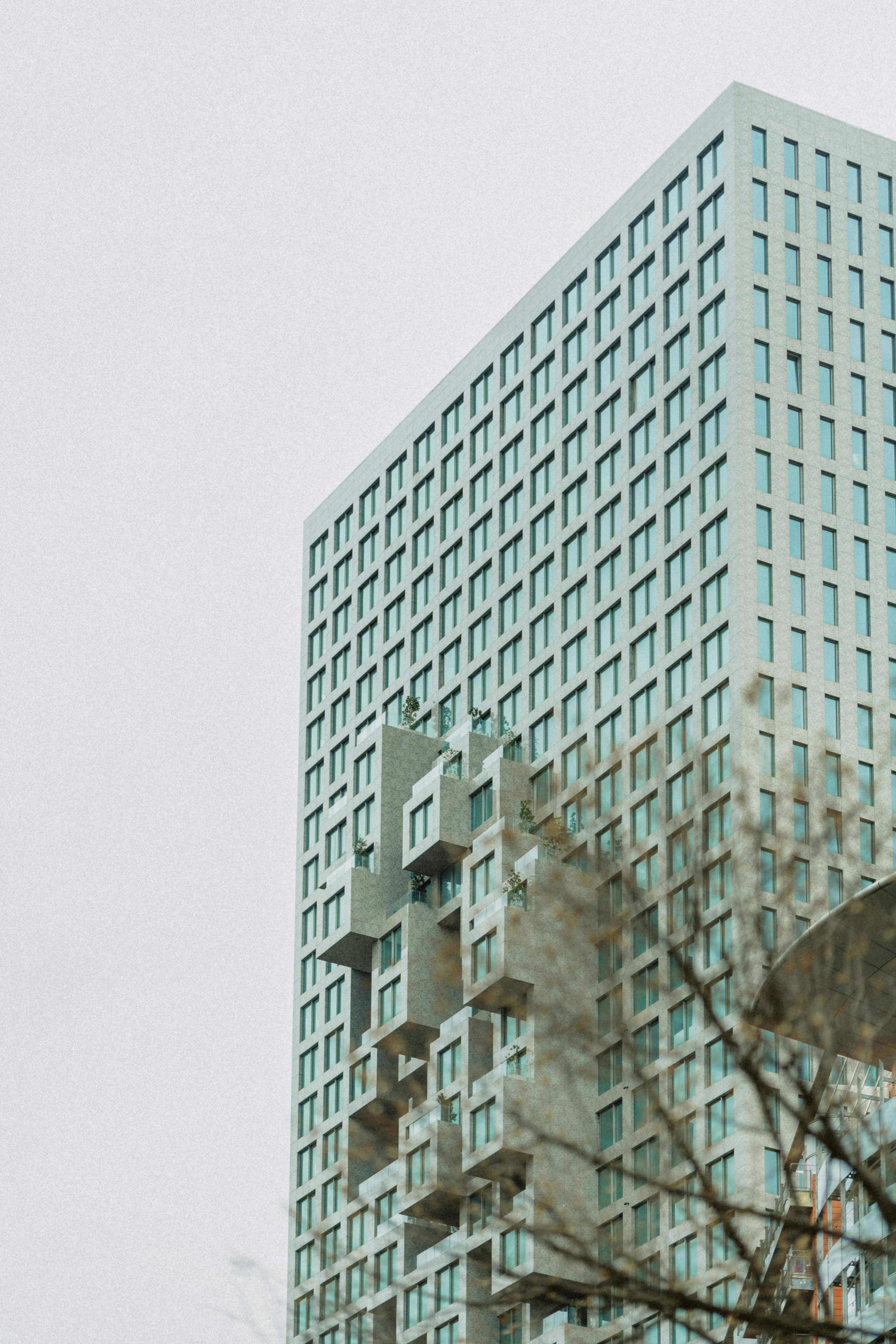 Modern Geometric High-Rise Building Architecture · Free Stock Photo