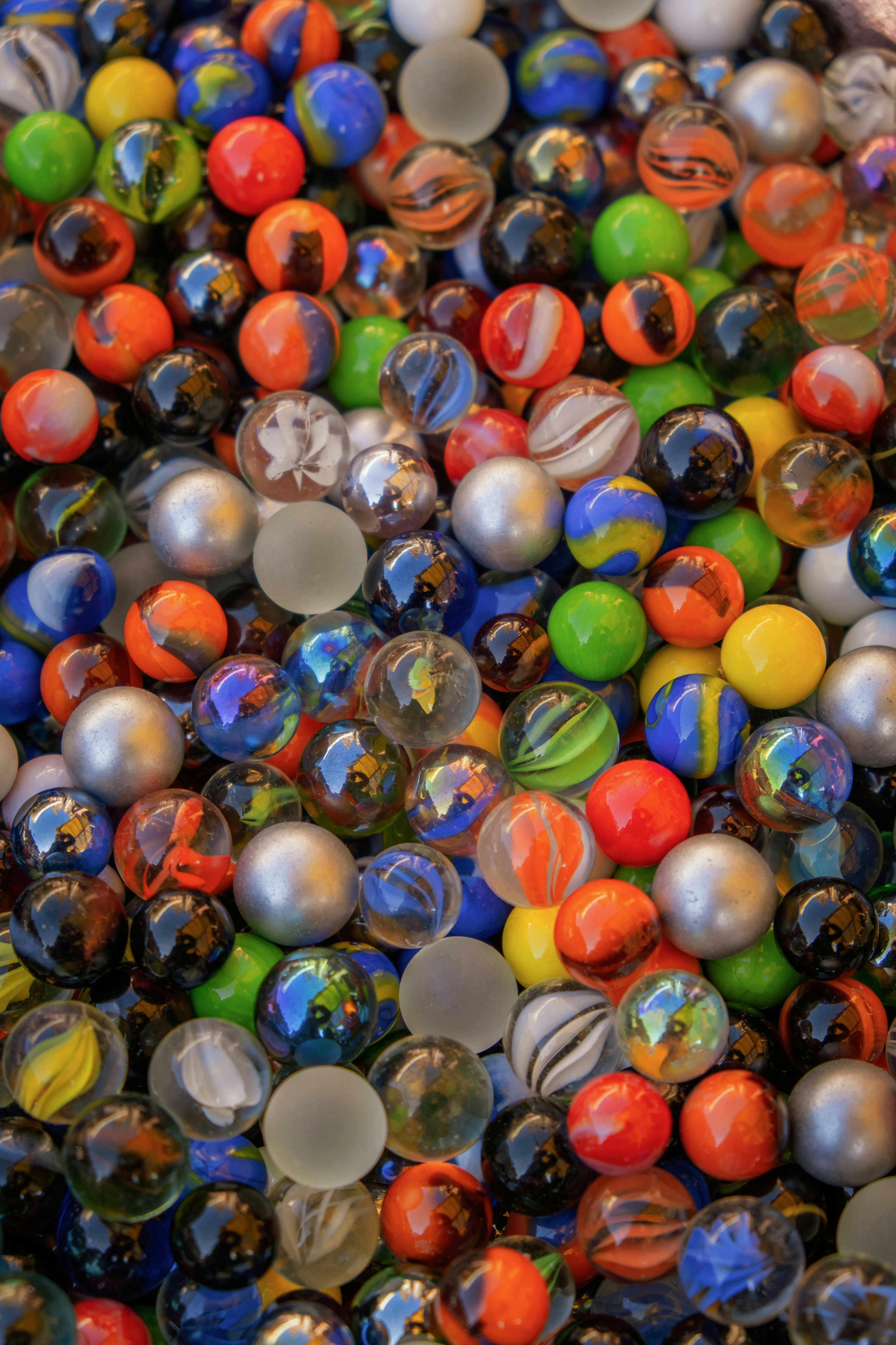 Vibrant Collection of Colorful Glass Marbles · Free Stock Photo