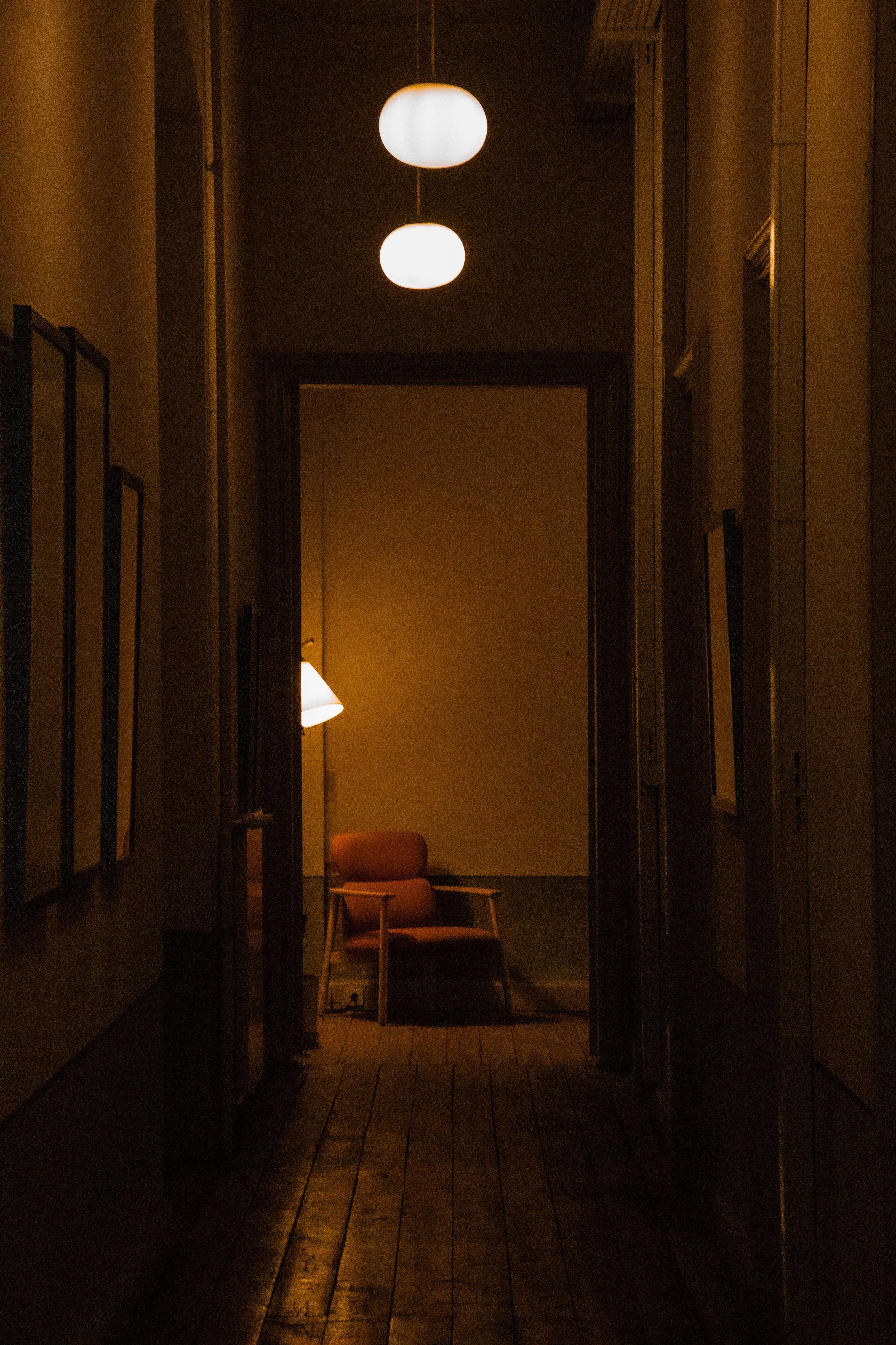 Cozy Chair in Dimly Lit Vintage Hallway · Free Stock Photo