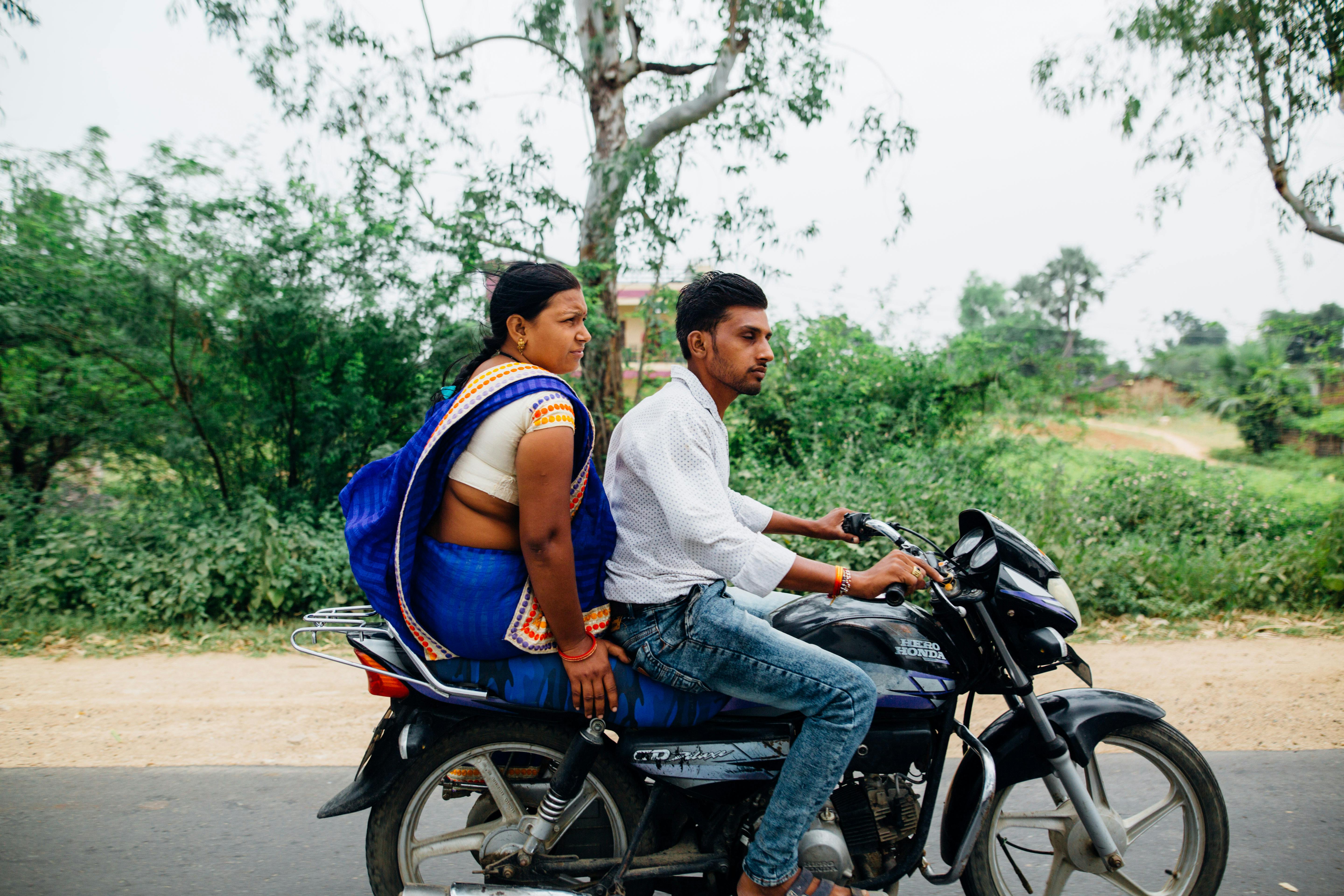 Man and Woman Riding on Motorcycle · Free Stock Photo