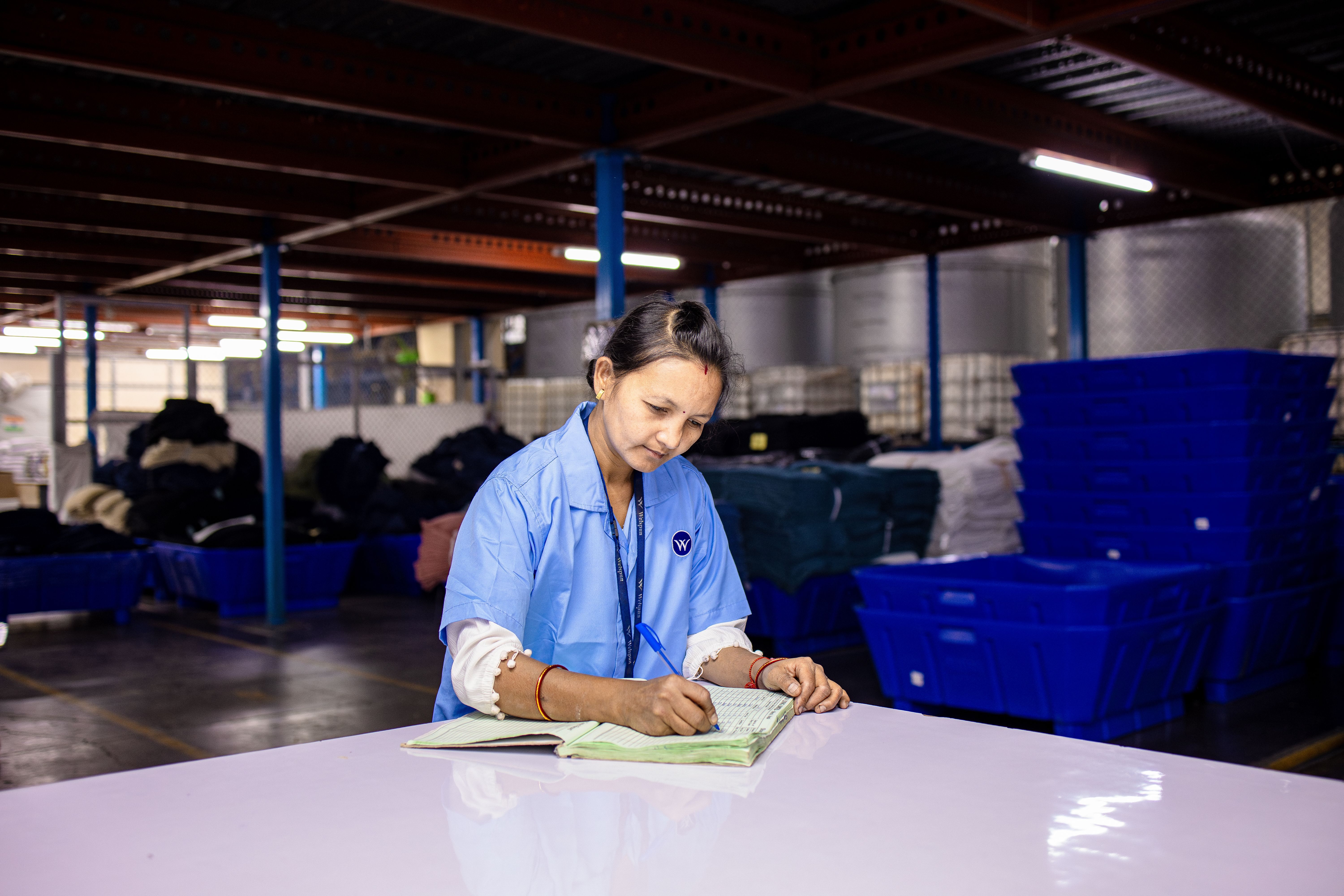 Female Factory Worker Recording Data in Warehouse · Free Stock Photo