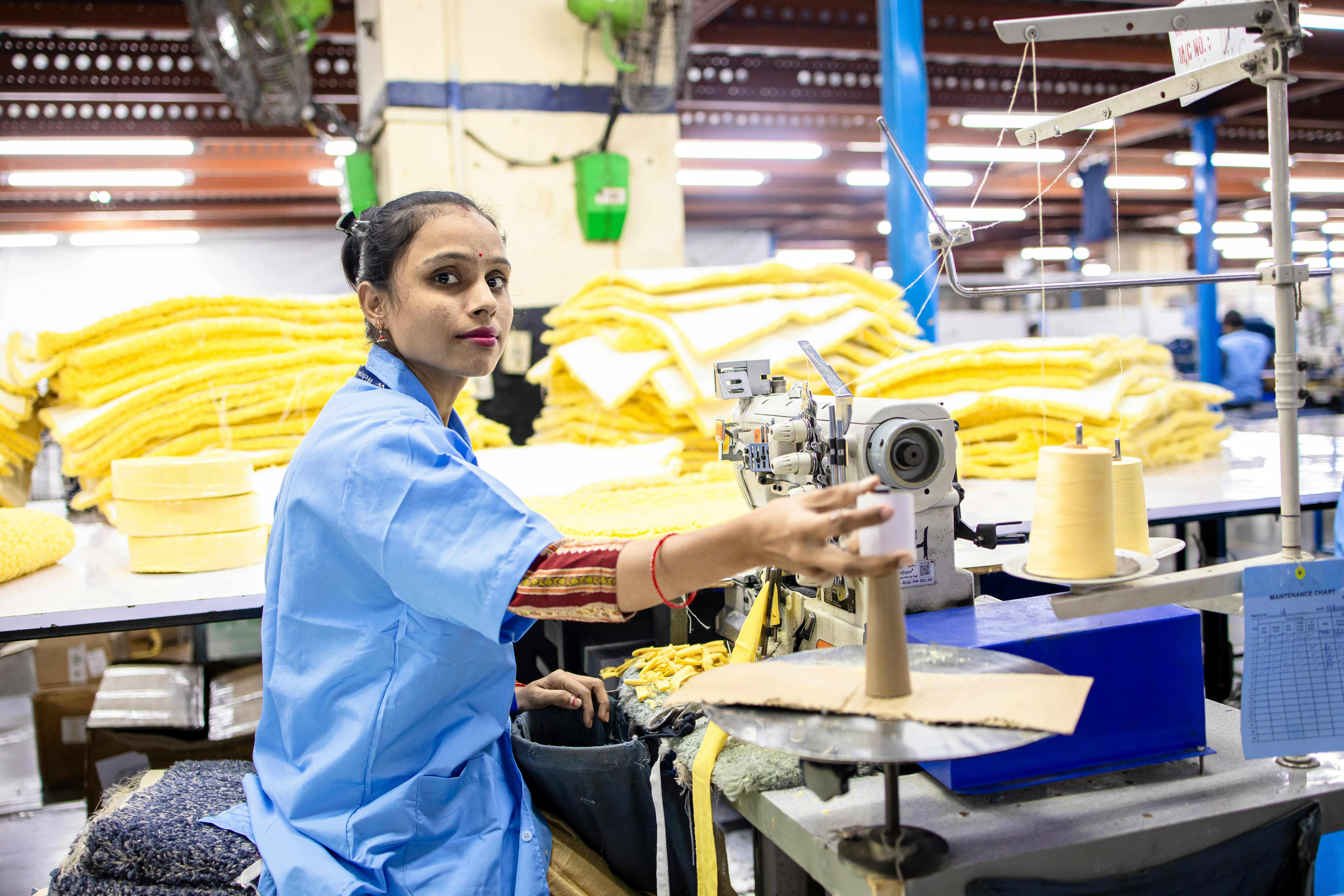 Female Textile Worker Operating Sewing Machine · Free Stock Photo