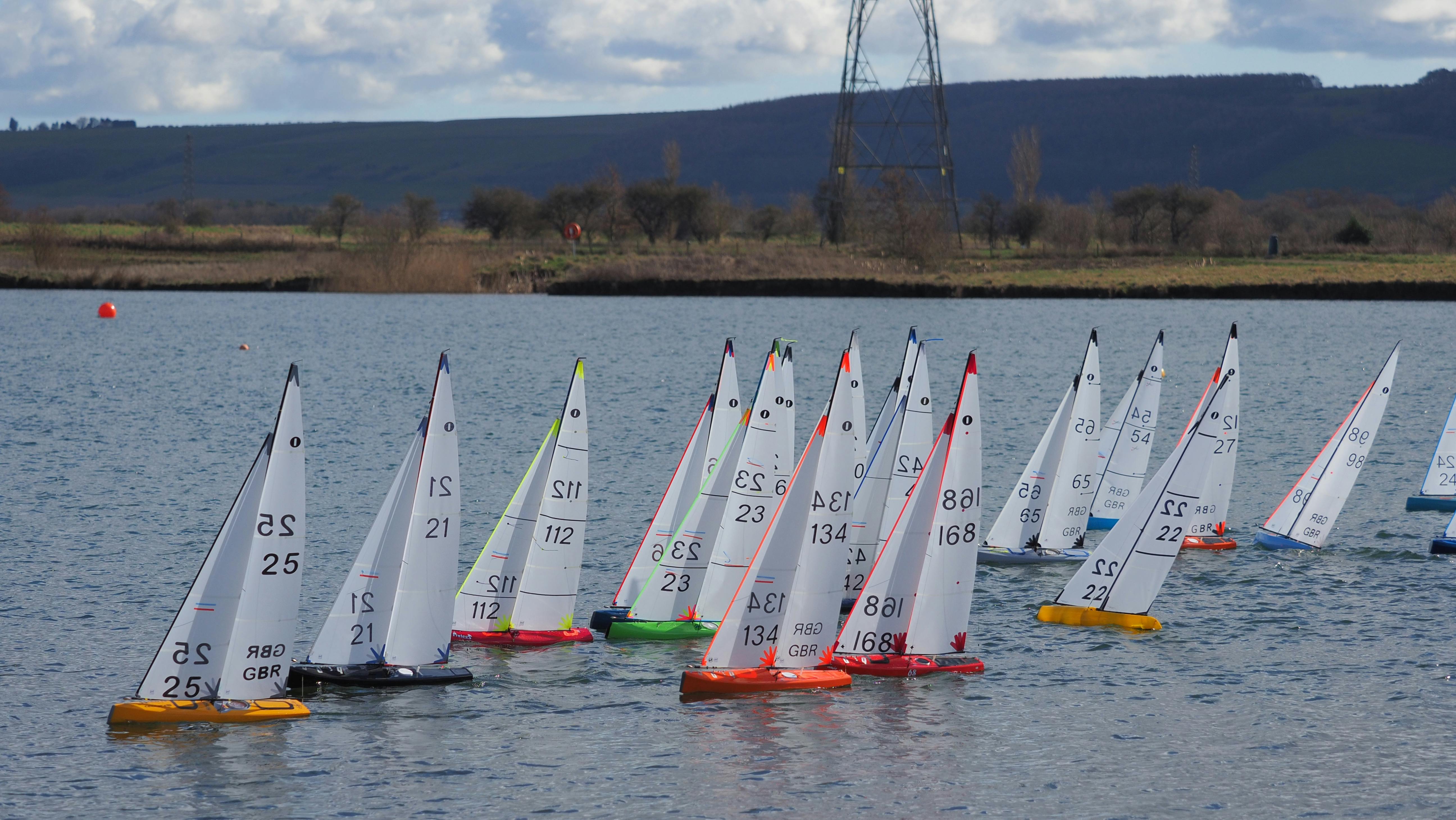 Model Yachts Racing on a Blue Lake in Wykeham · Free Stock Photo