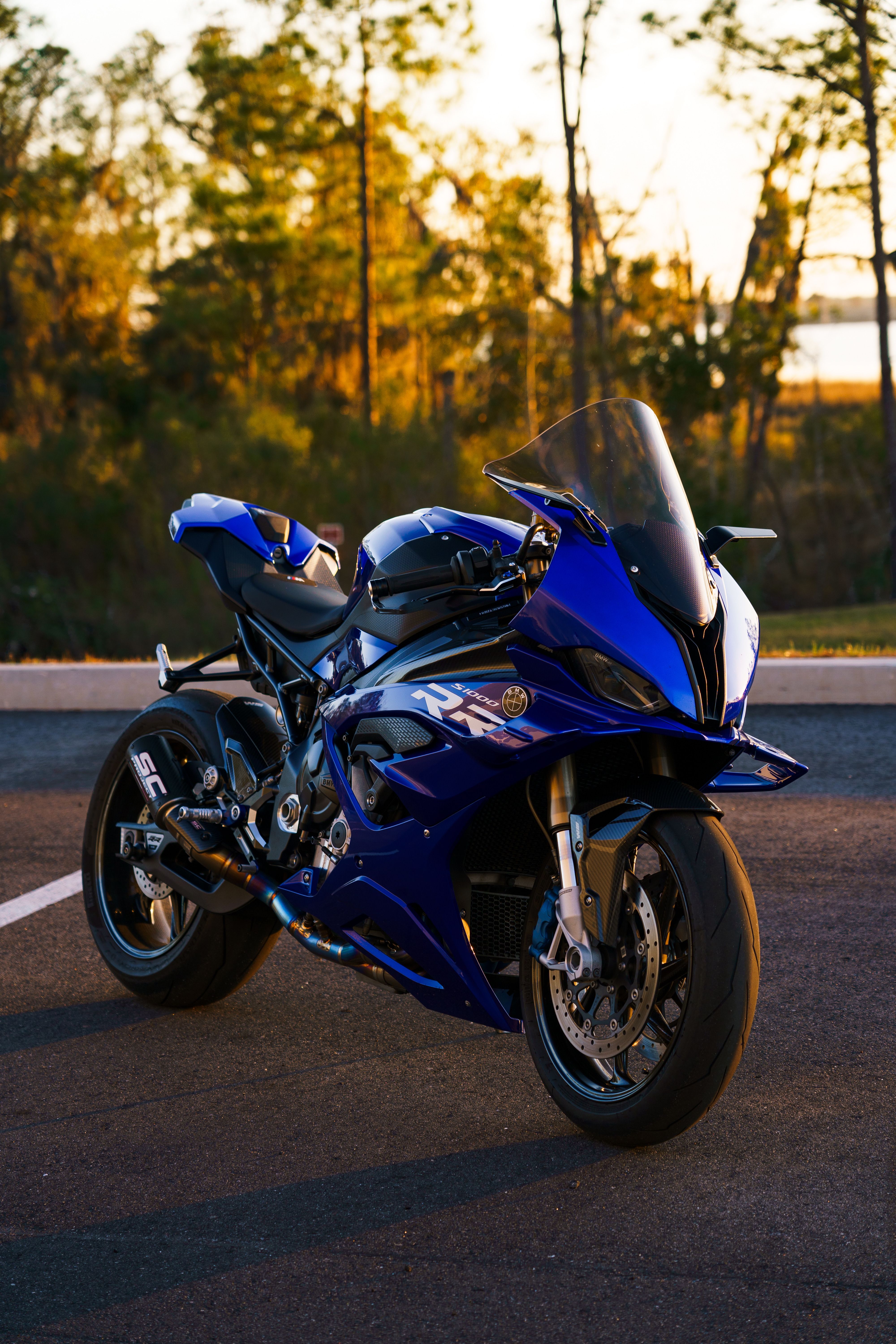 Blue Sports Motorcycle at Sunset Outdoors · Free Stock Photo