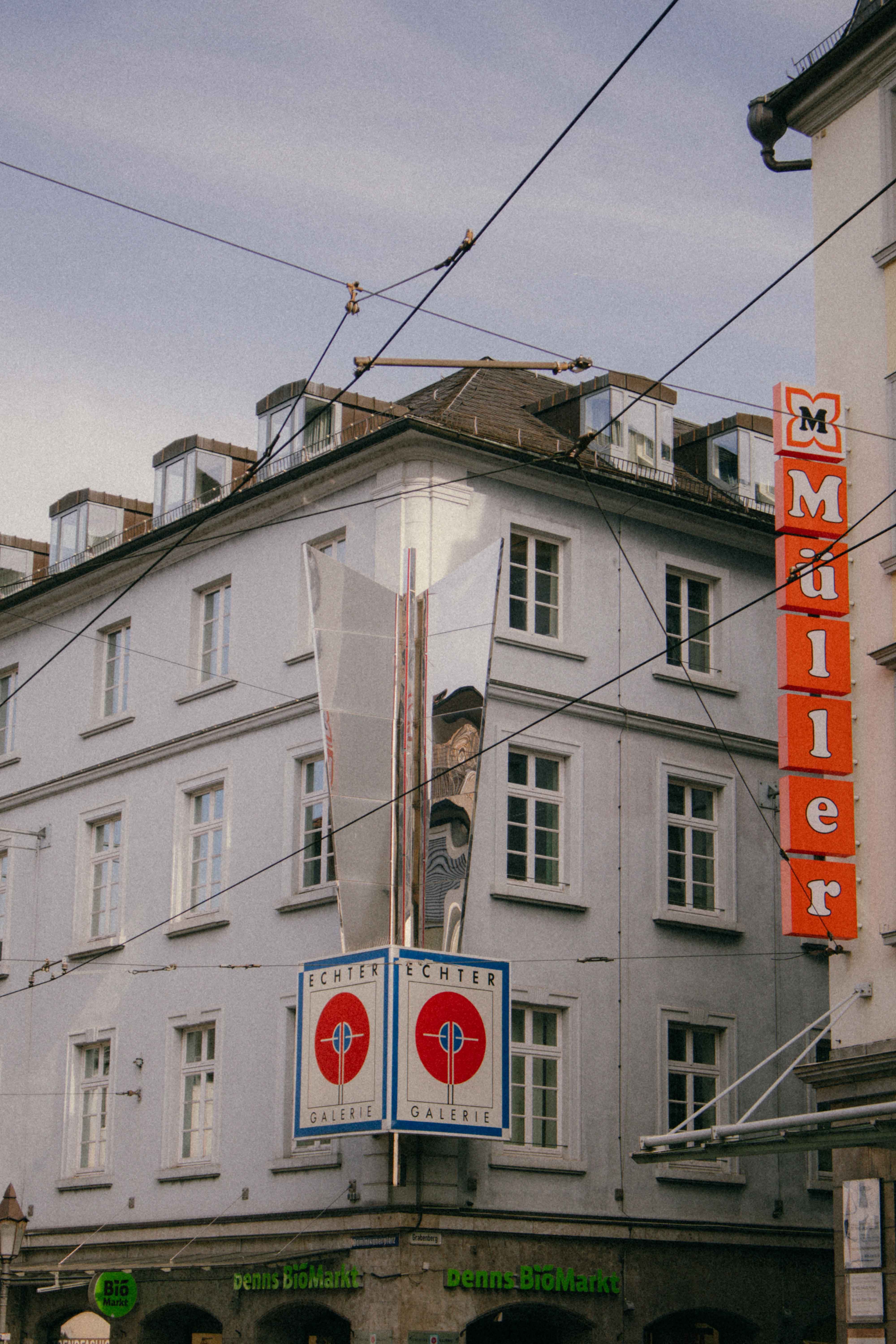 Urban Architecture with Müller Signage at Dusk · Free Stock Photo