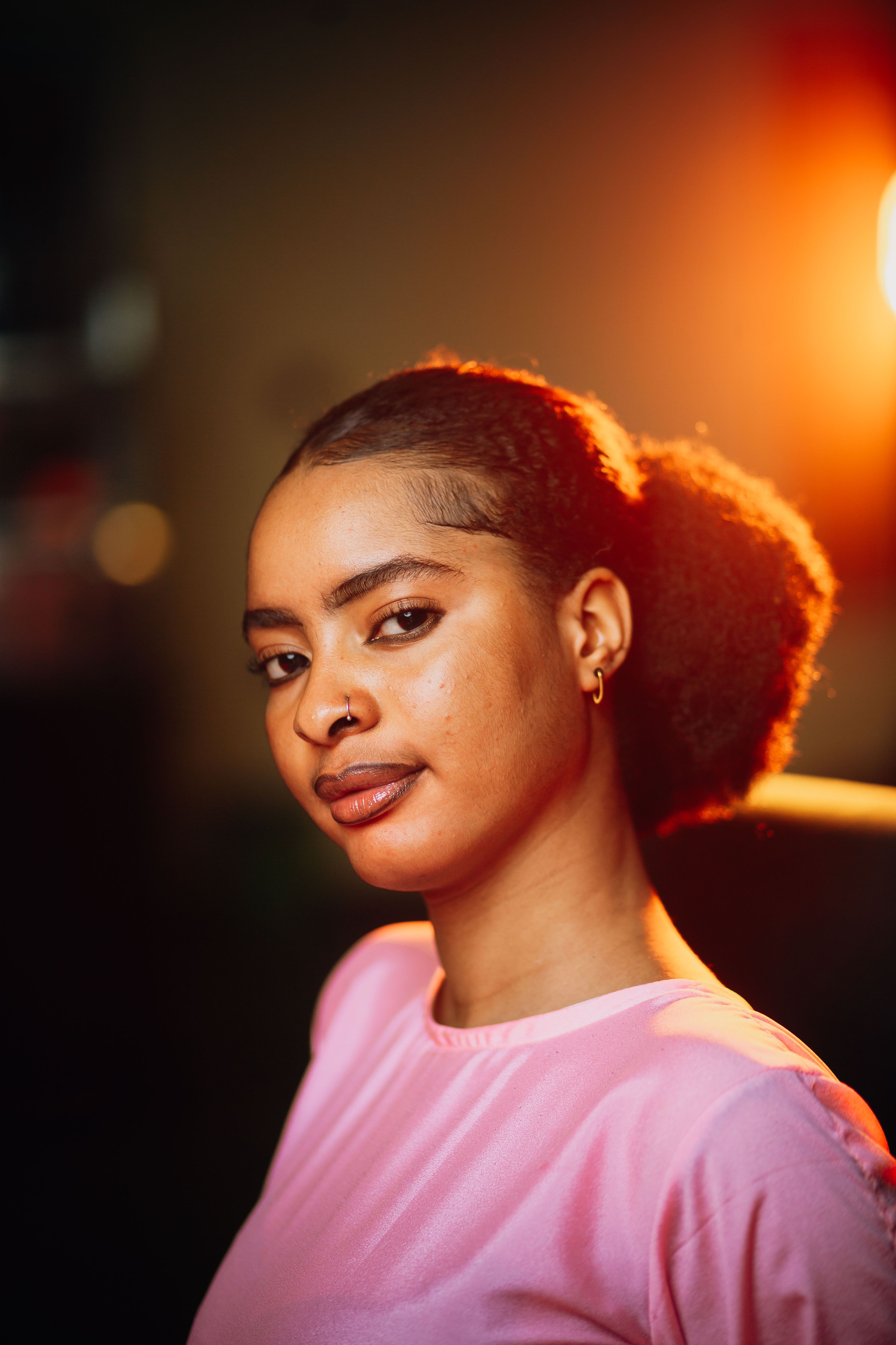 Portrait of a Young Woman with Warm Lighting · Free Stock Photo