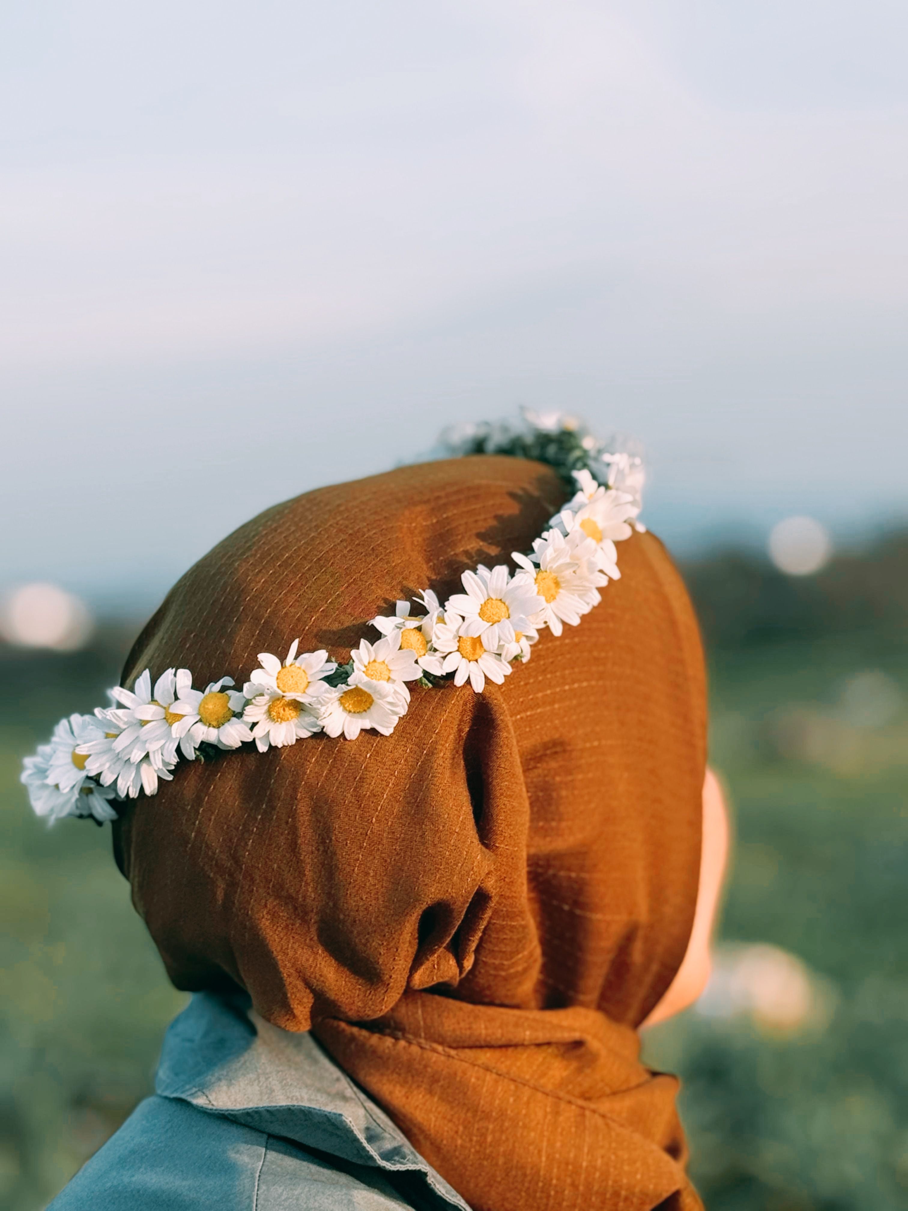 Person with Daisy Crown in Spring Landscape · Free Stock Photo