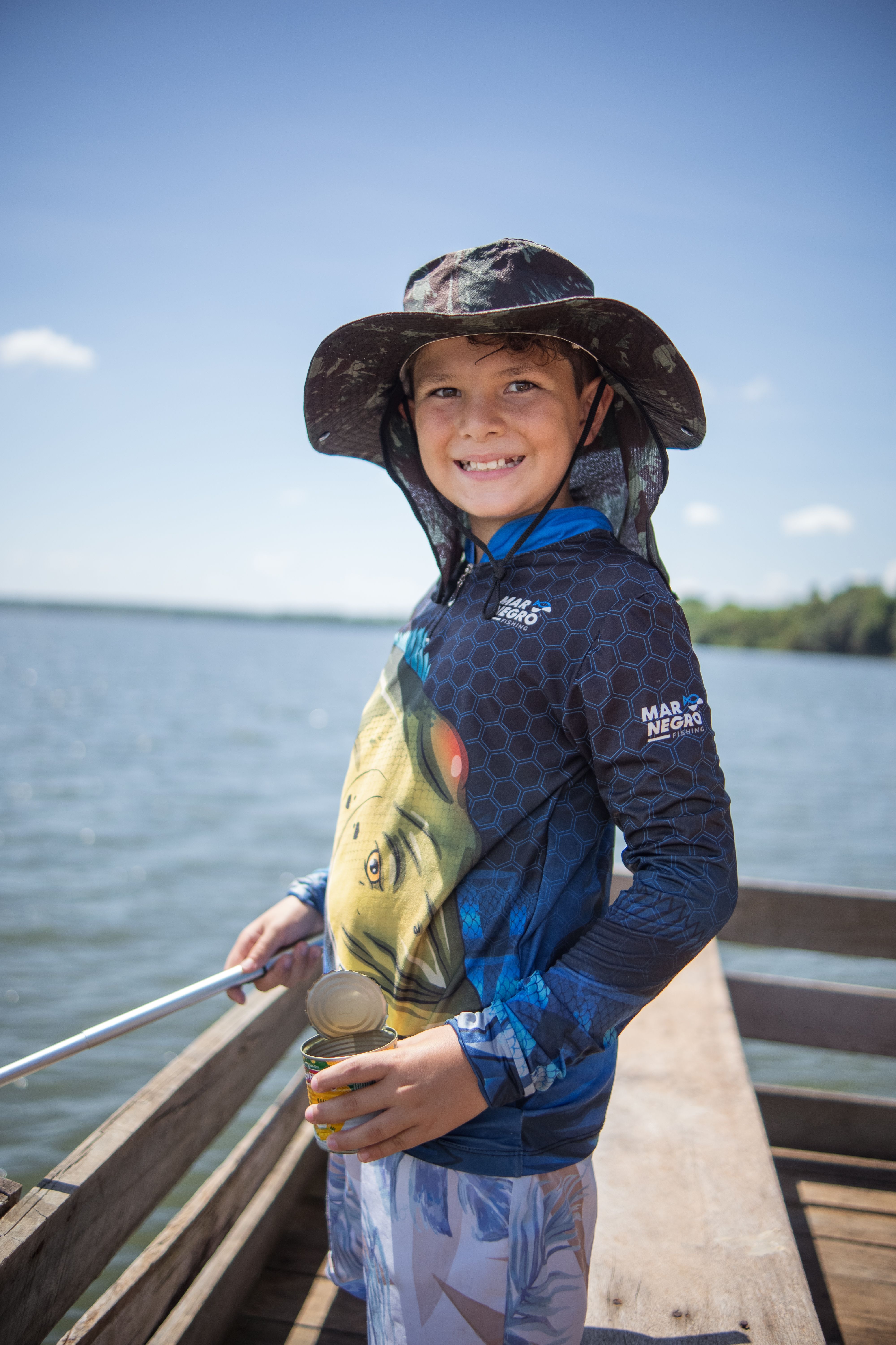 Young Boy Fishing on a Sunny Day at Lake · Free Stock Photo