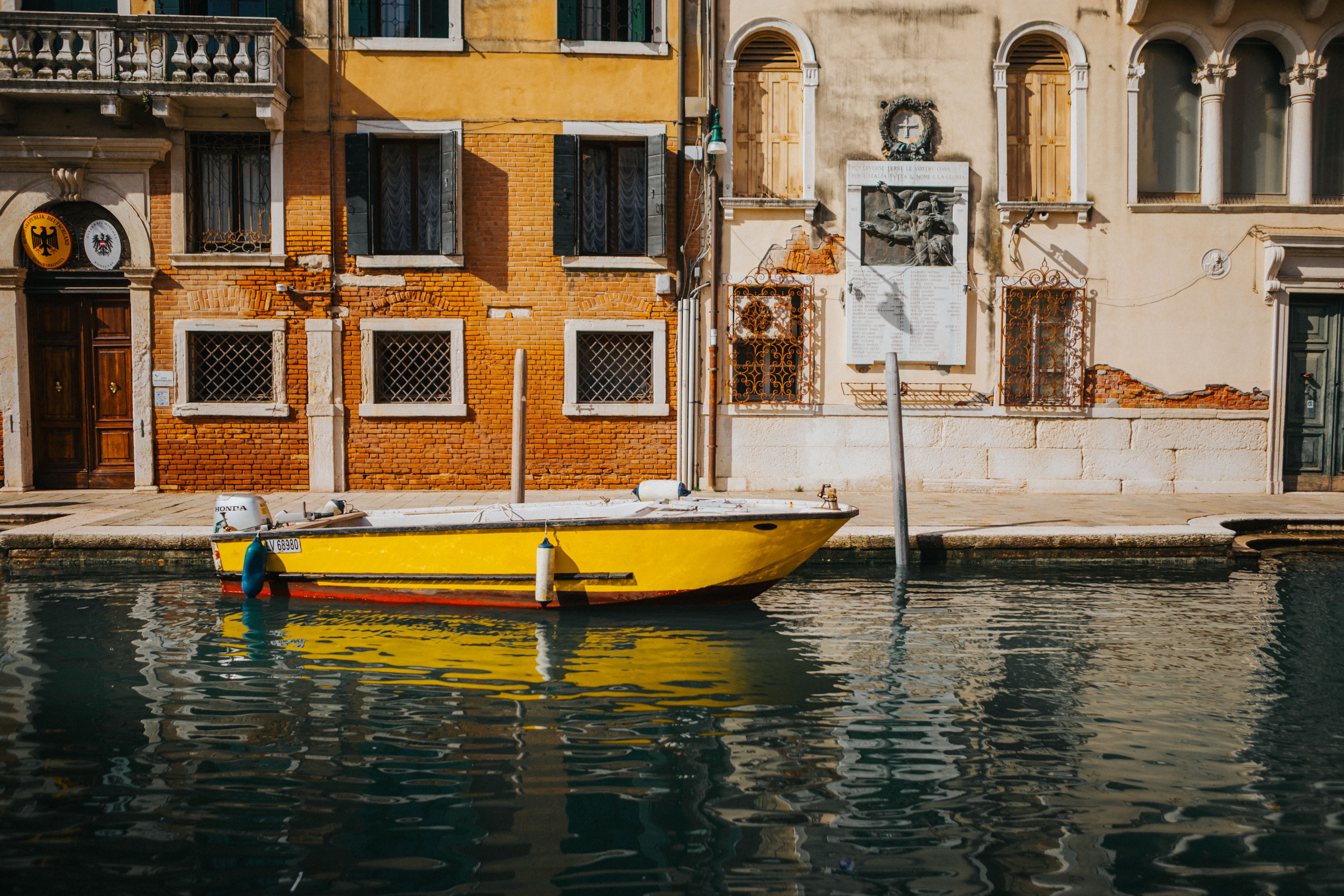 Bright Yellow Boat on Venetian Canal · Free Stock Photo