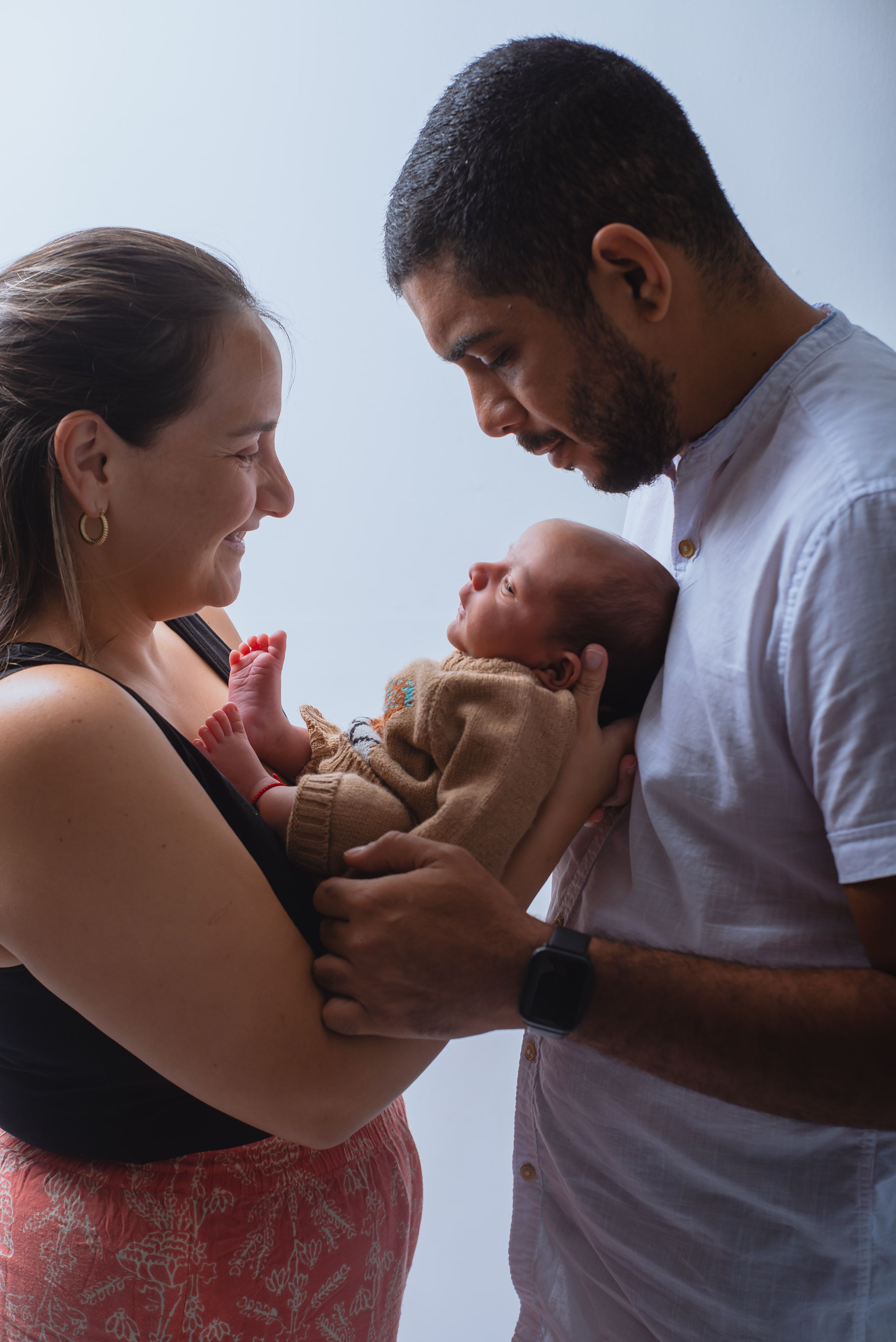 Loving Parents Holding Their Newborn Baby · Free Stock Photo