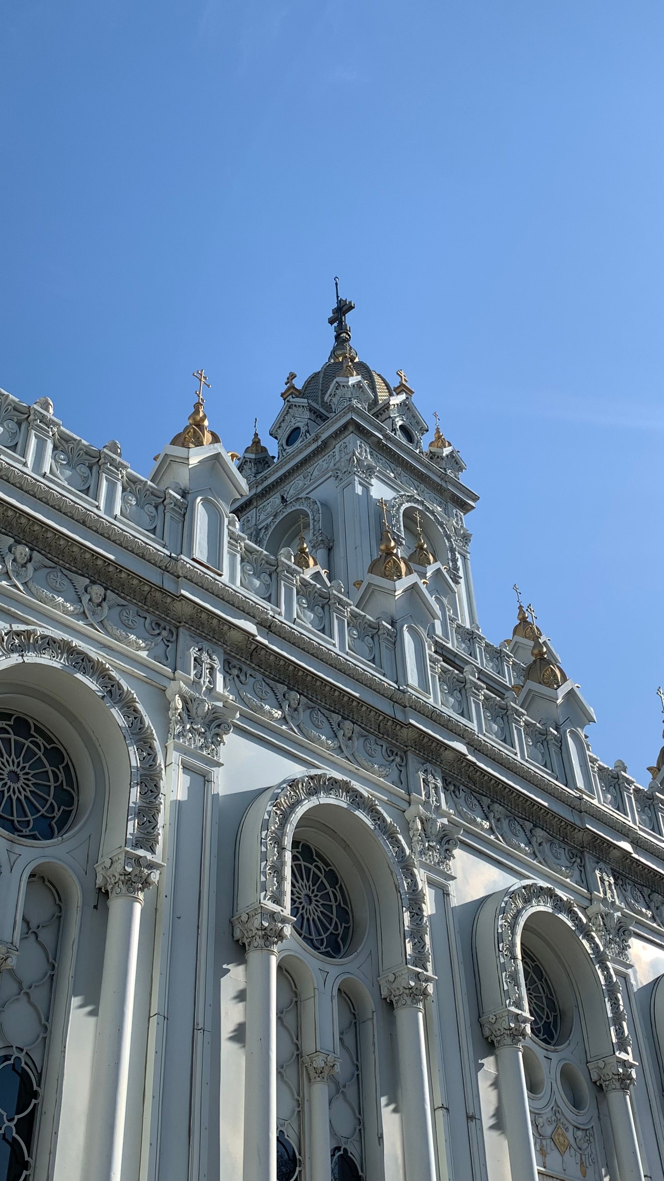 Ornate White Church Facade Against Blue Sky · Free Stock Photo