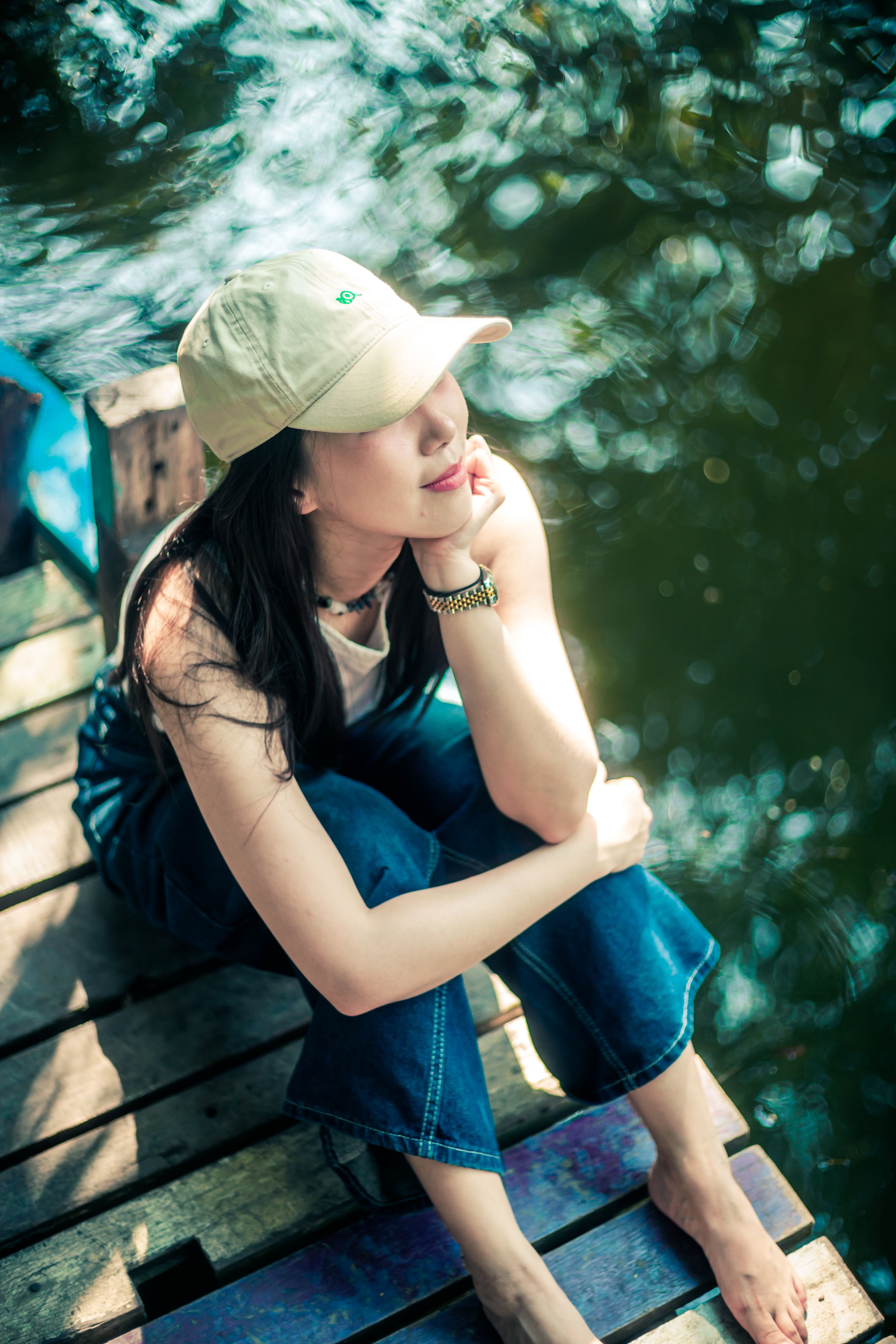 Calm Woman Relaxing by the Water's Edge · Free Stock Photo