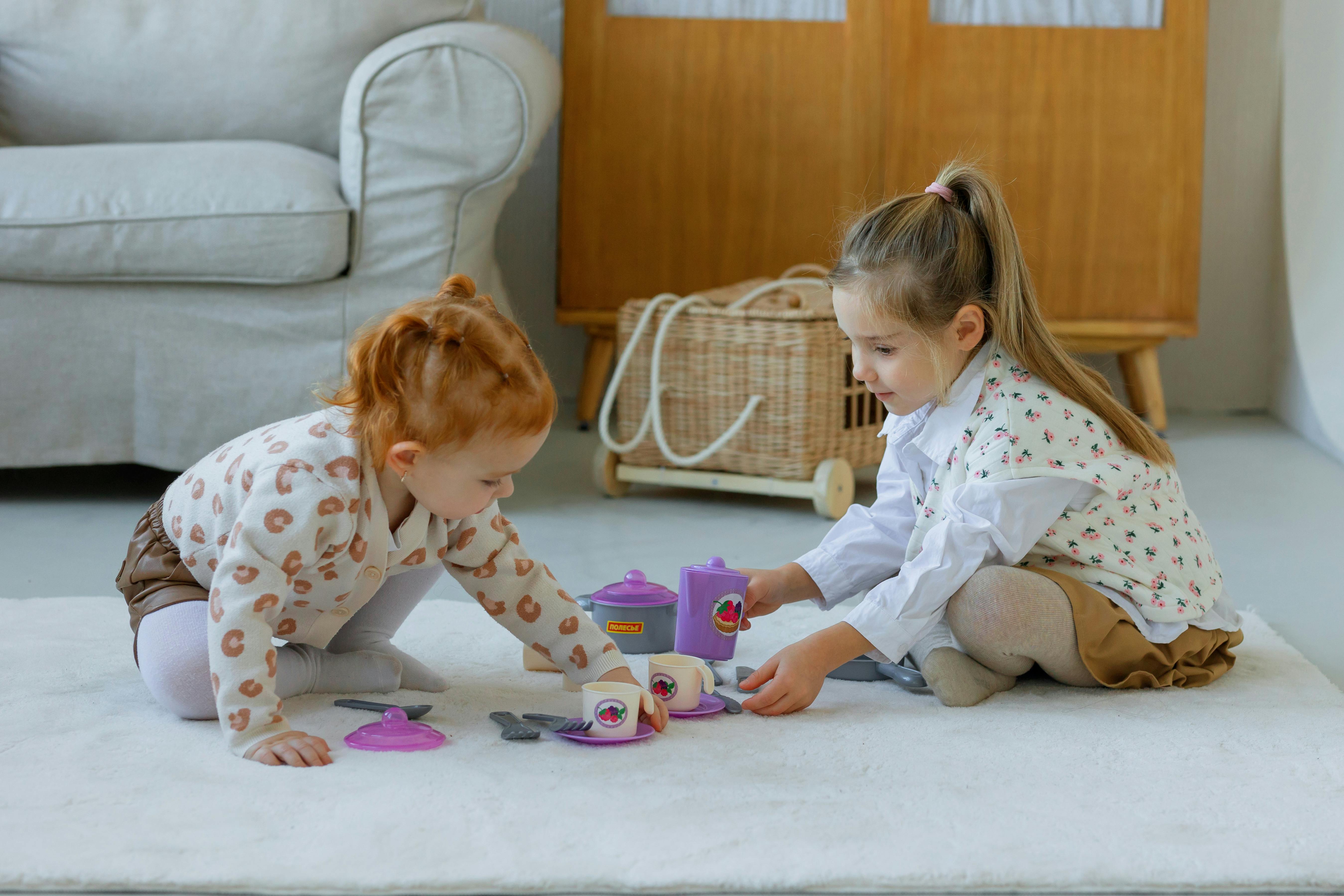 Children Playing Tea Party Indoors on Carpet · Free Stock Photo