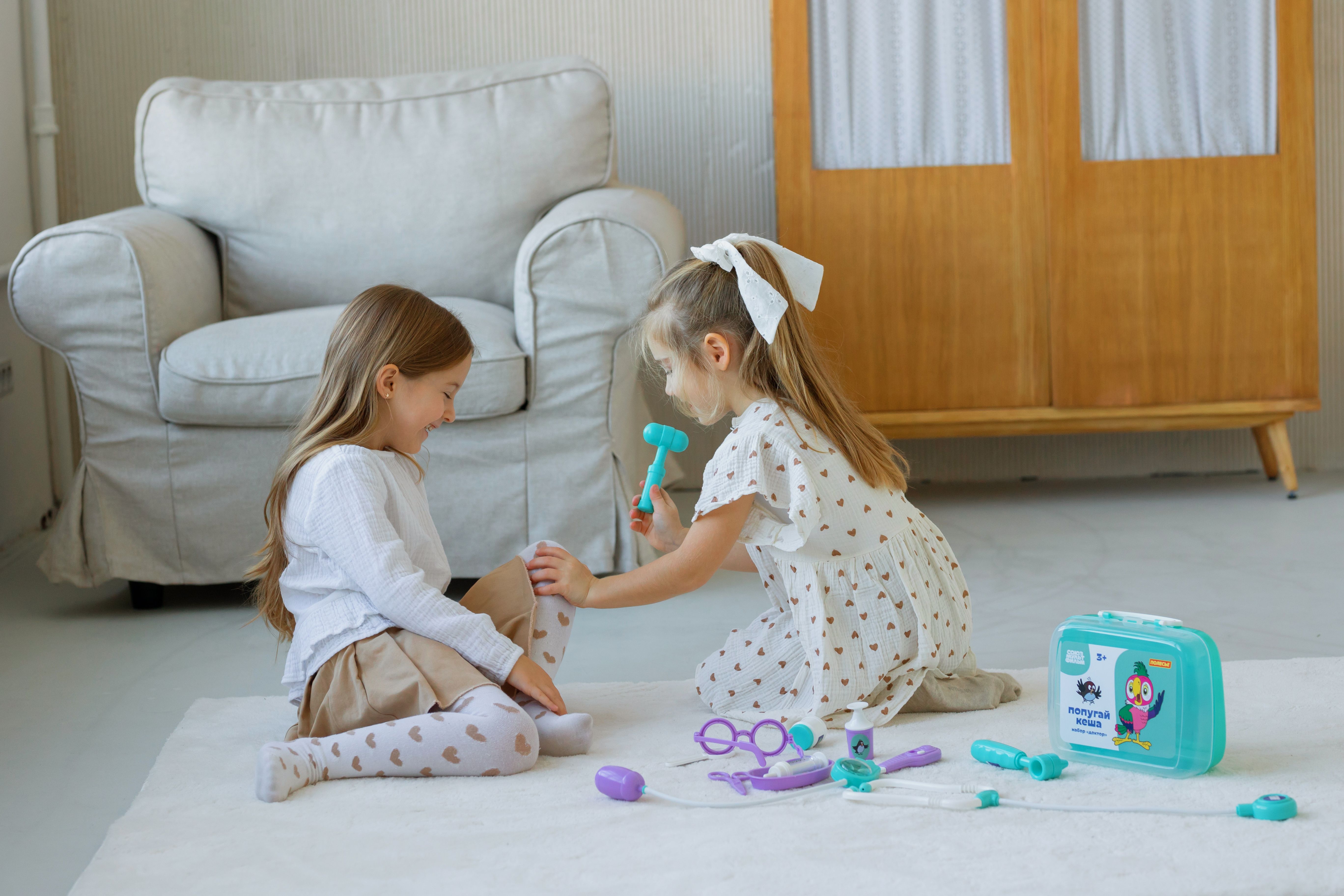 Children Playing Doctor in Cozy Indoor Setting · Free Stock Photo