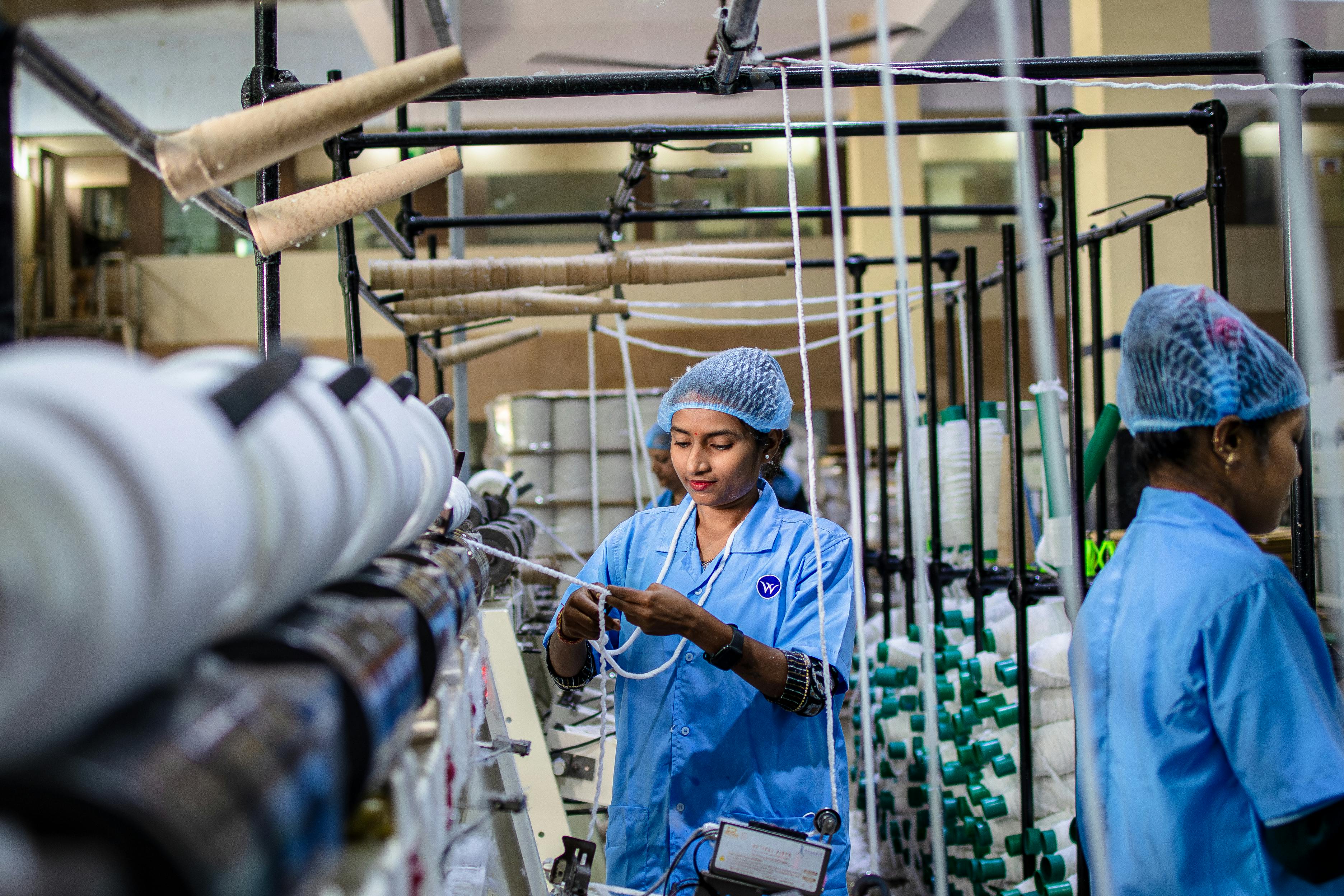 Female Textile Workers in a Factory Setting · Free Stock Photo