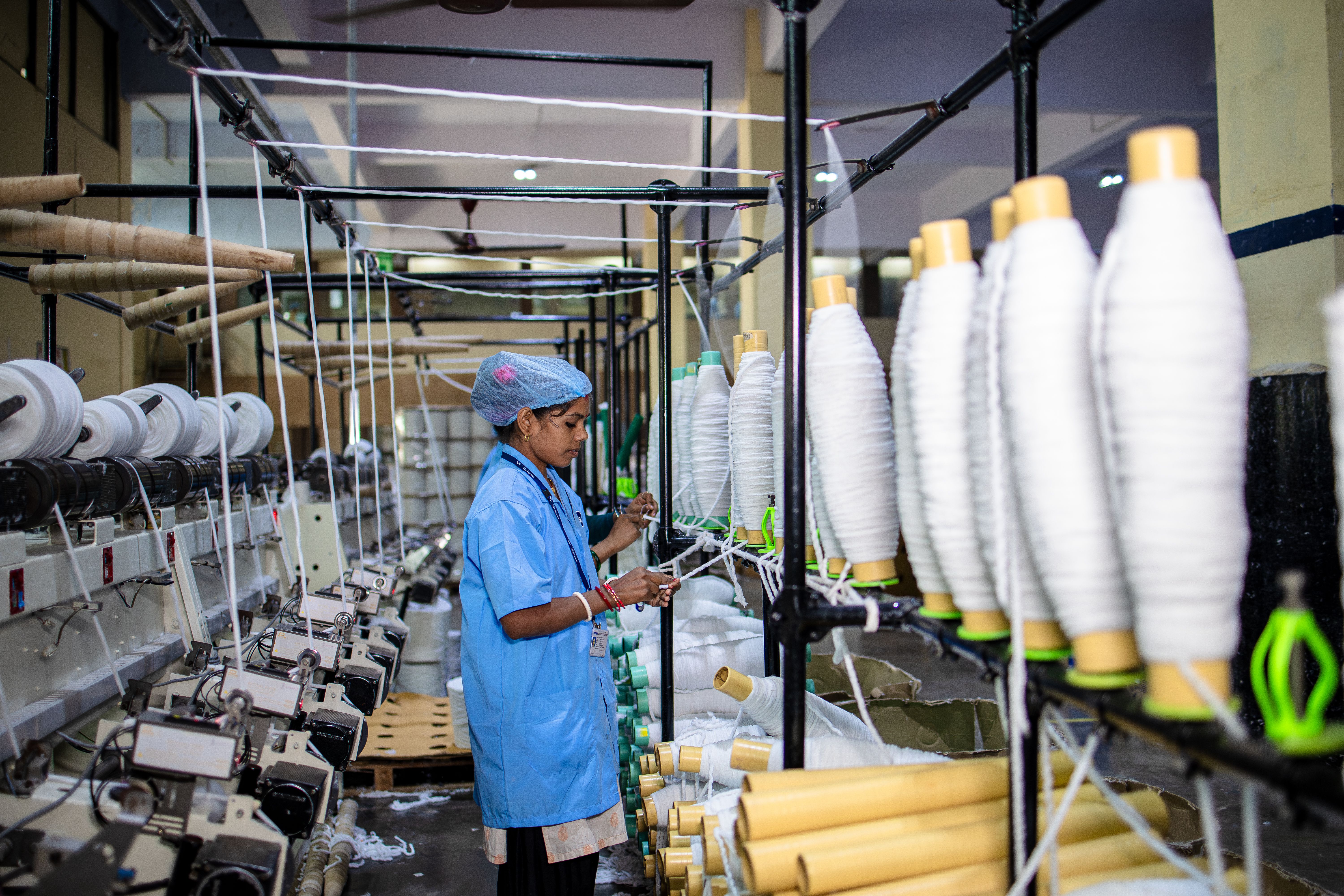 Worker in Textile Factory Managing Machinery · Free Stock Photo