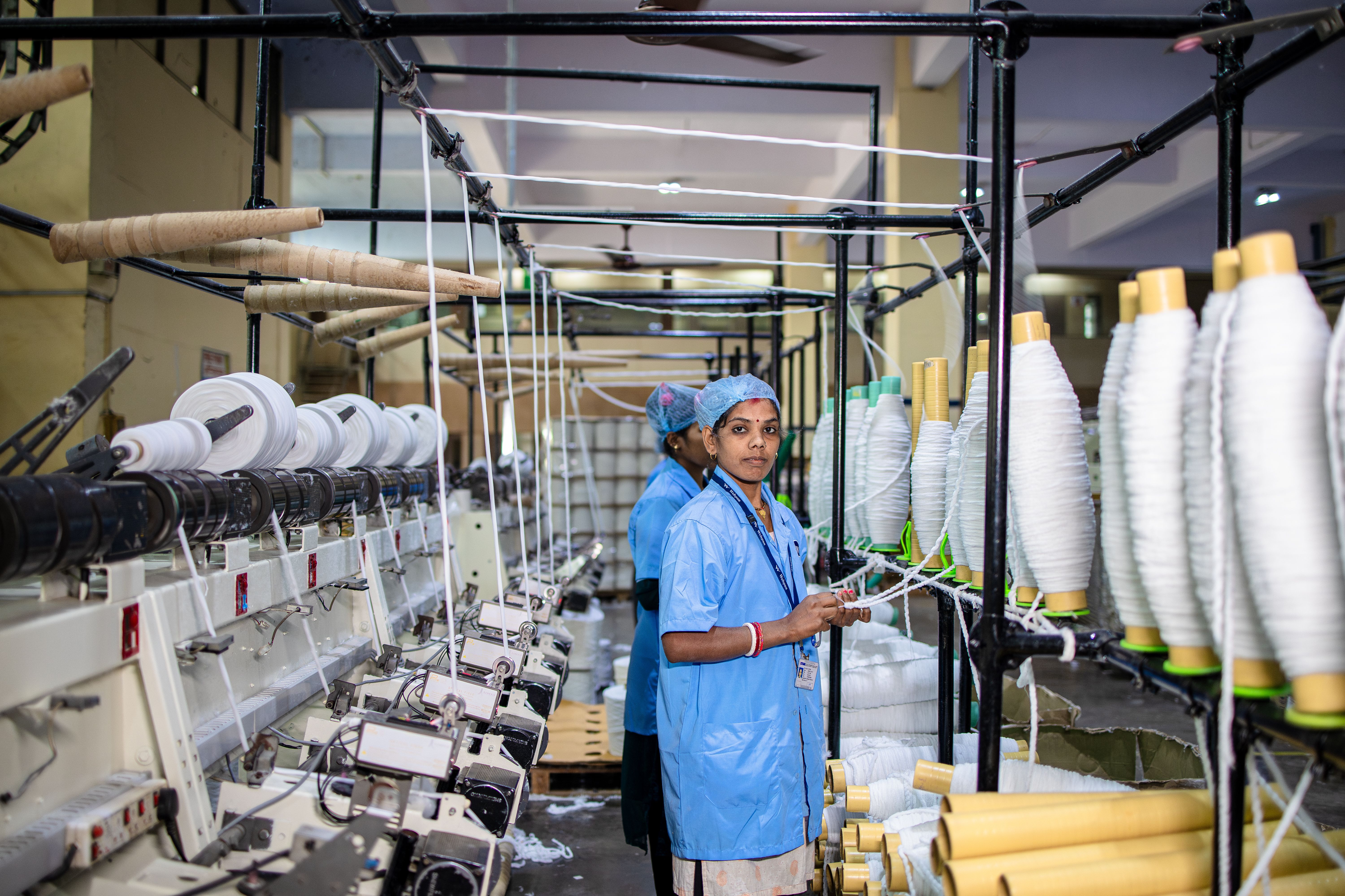 Indian Textile Factory Workers Operating Machinery · Free Stock Photo