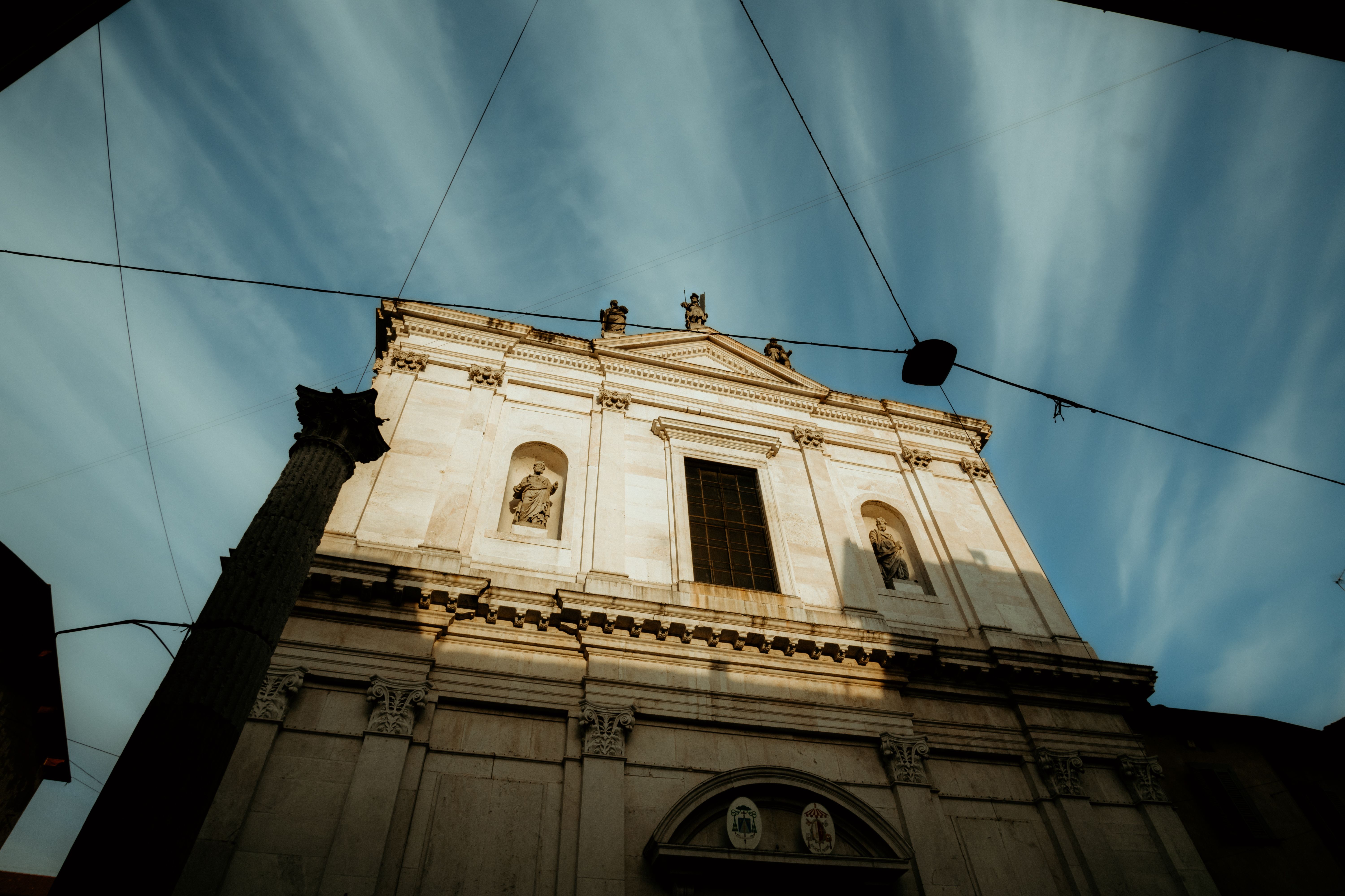 Historic Church Exterior Under Dramatic Sky · Free Stock Photo